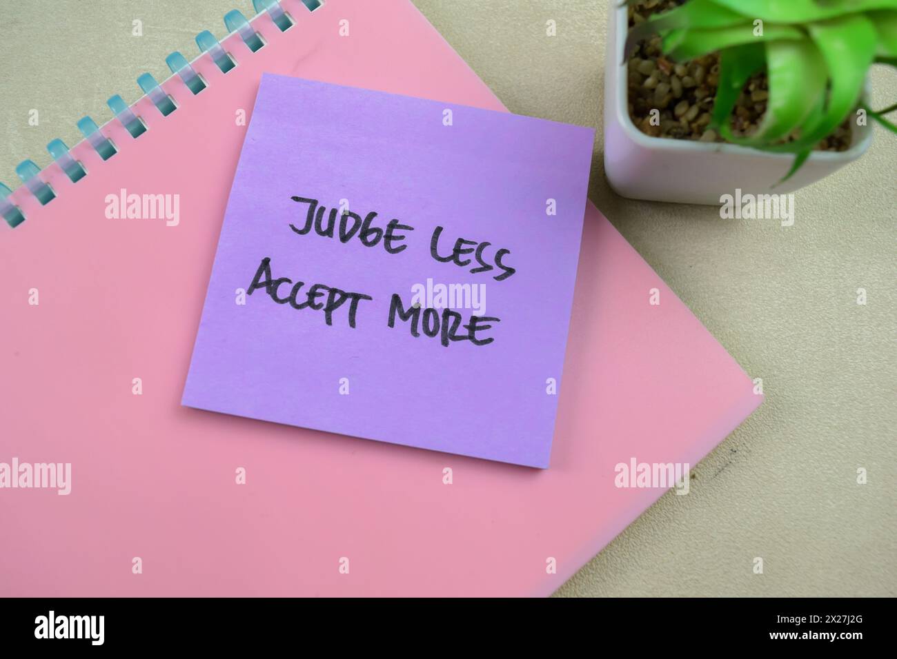 Concept of Judge Less Accept More write on sticky notes isolated on ...