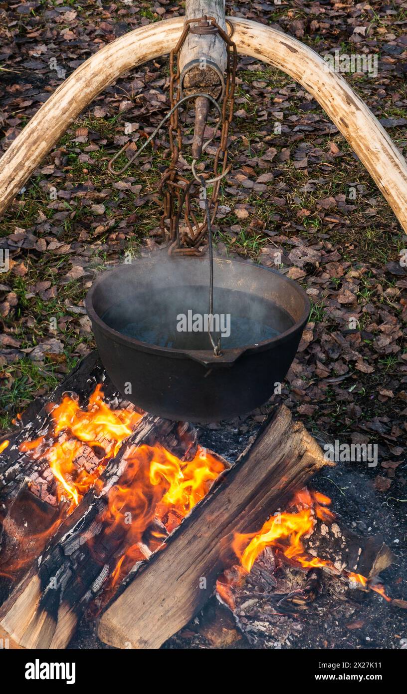 Old pot cooking over campfire hi-res stock photography and images - Alamy