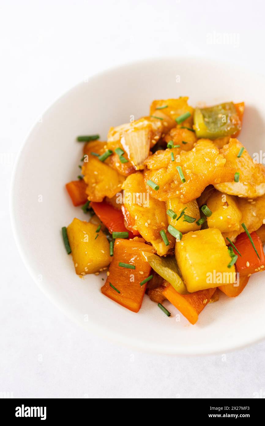 Sweet and sour chicken with bell peppers and pineapple Stock Photo - Alamy