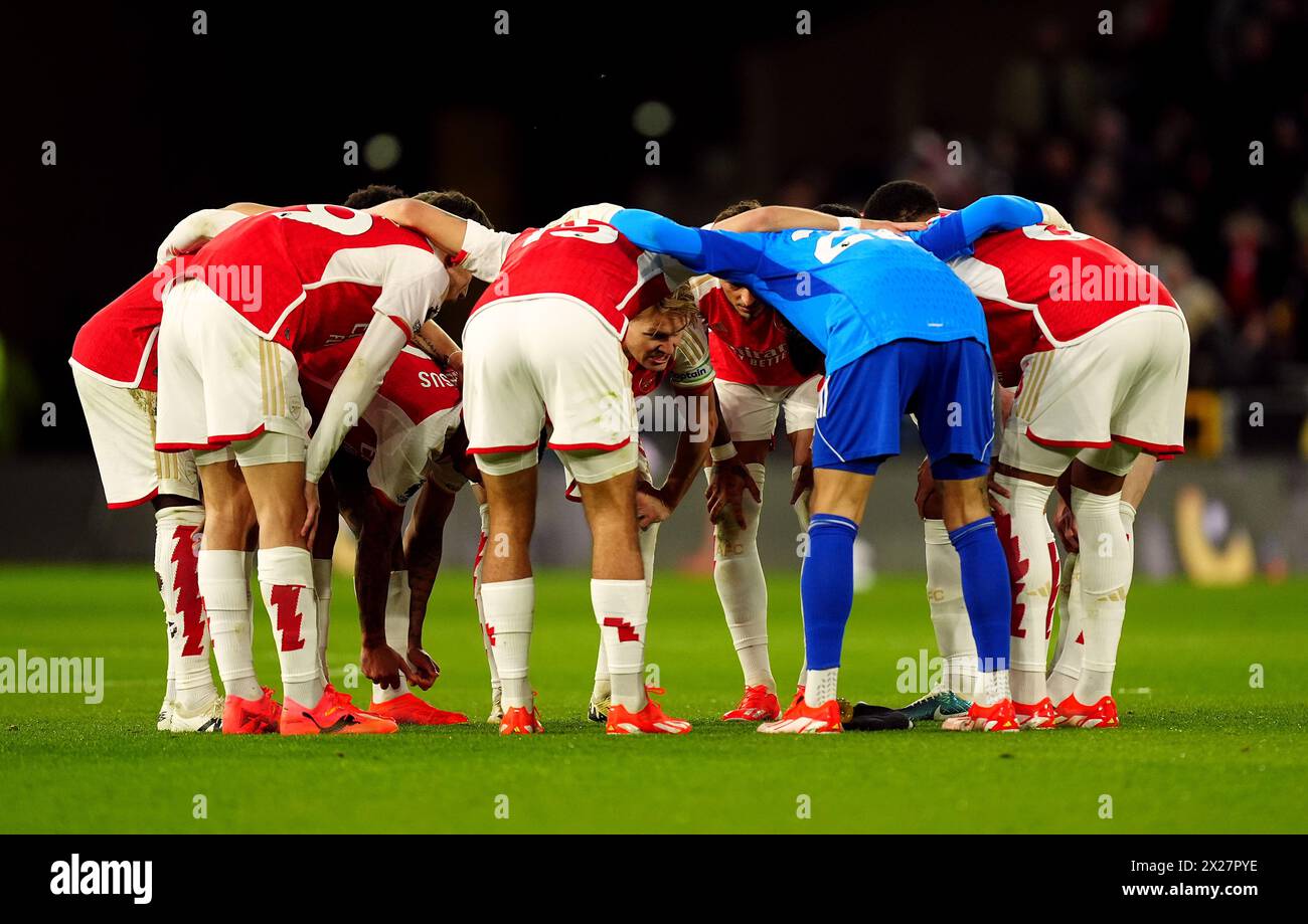 Arsenal players have a team huddle during the Premier League match at ...