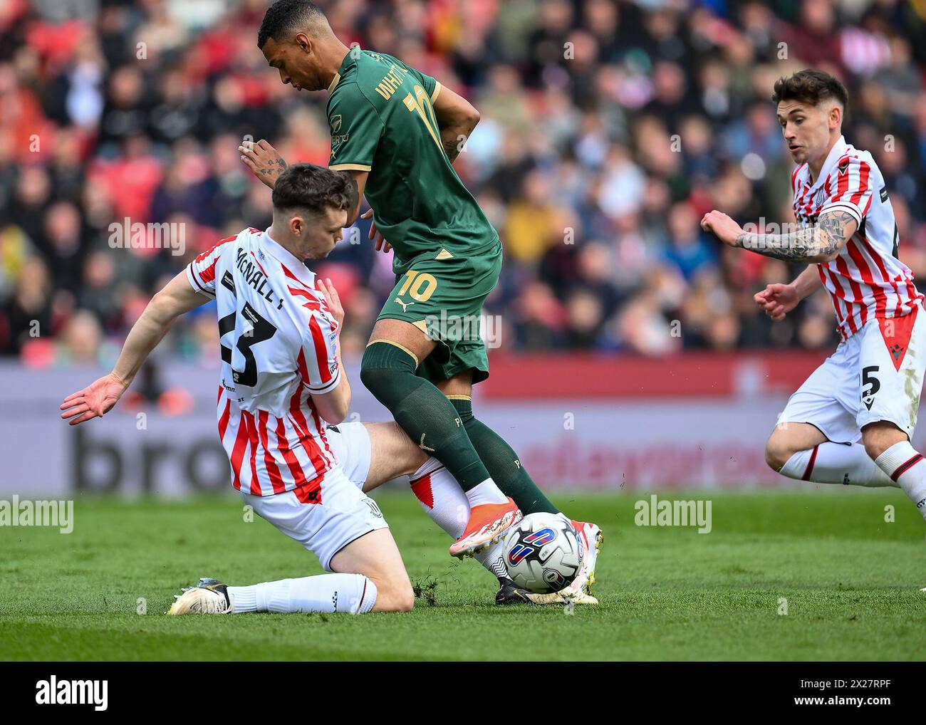 Luke McNally of Stoke City defending Morgan Whittaker of Plymouth ...