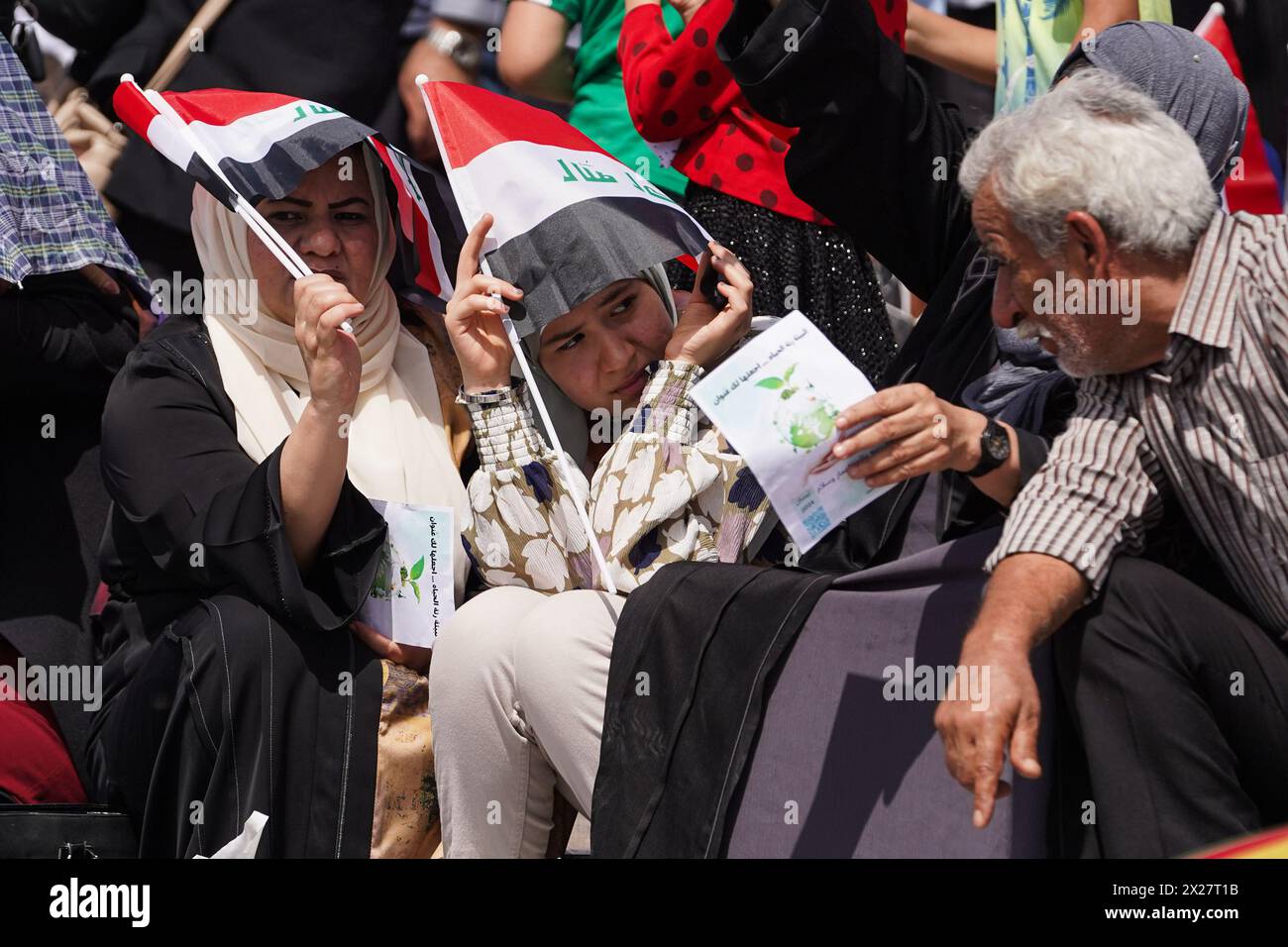 Mosul, Iraq. 20th Apr, 2024. Iraqi women hold Iraqi flags during Spring ...