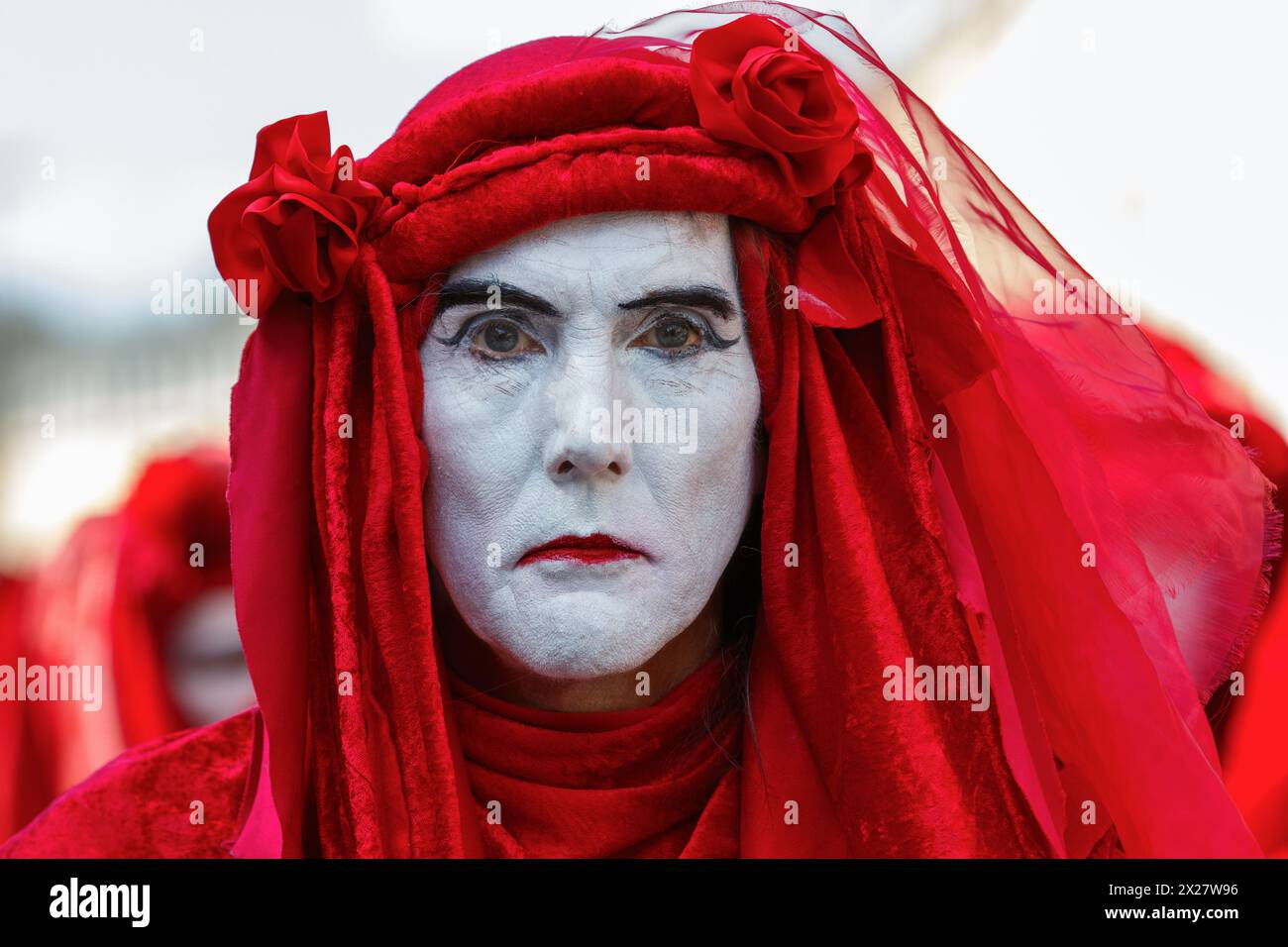 Bath, UK. 20th Apr, 2024. Dressed in their distinctive red rebel ...