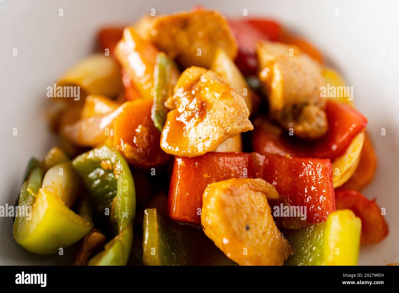 Sweet and sour chicken with bell peppers Stock Photo - Alamy