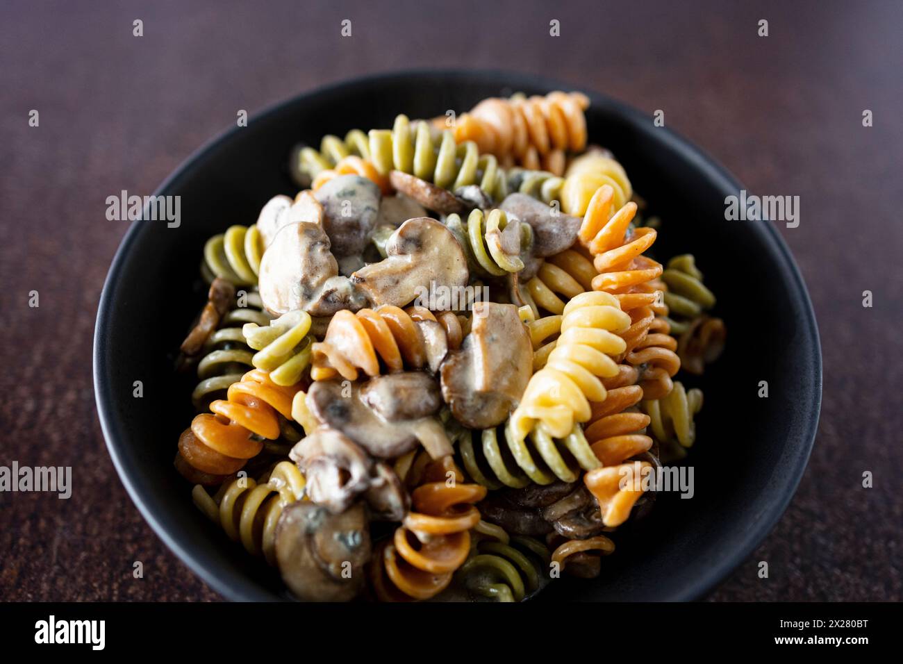 Fusilli with mushroom and gorgonzola Stock Photo - Alamy
