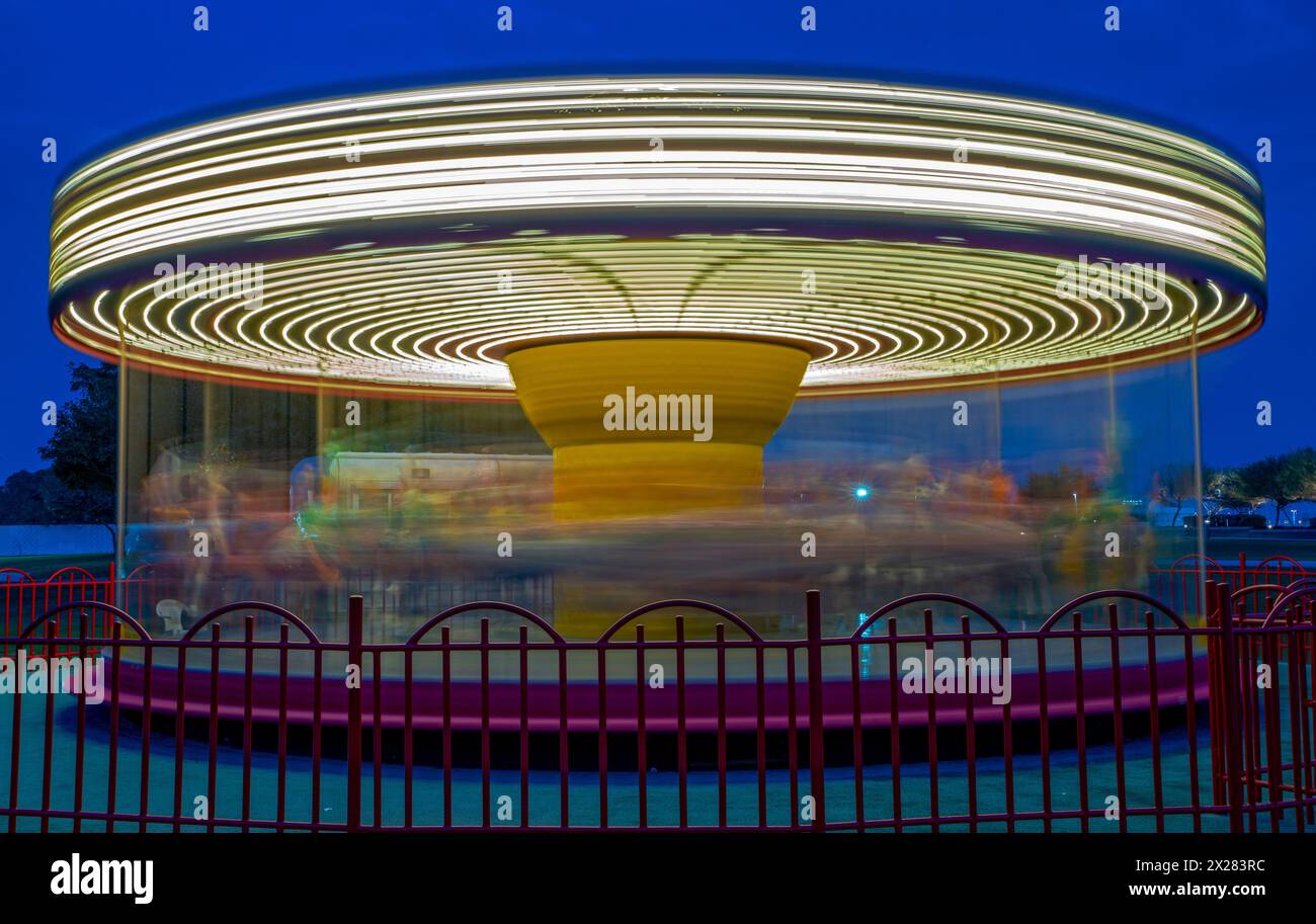 Kids carnival ride amusement park.long exposure shot Stock Photo - Alamy