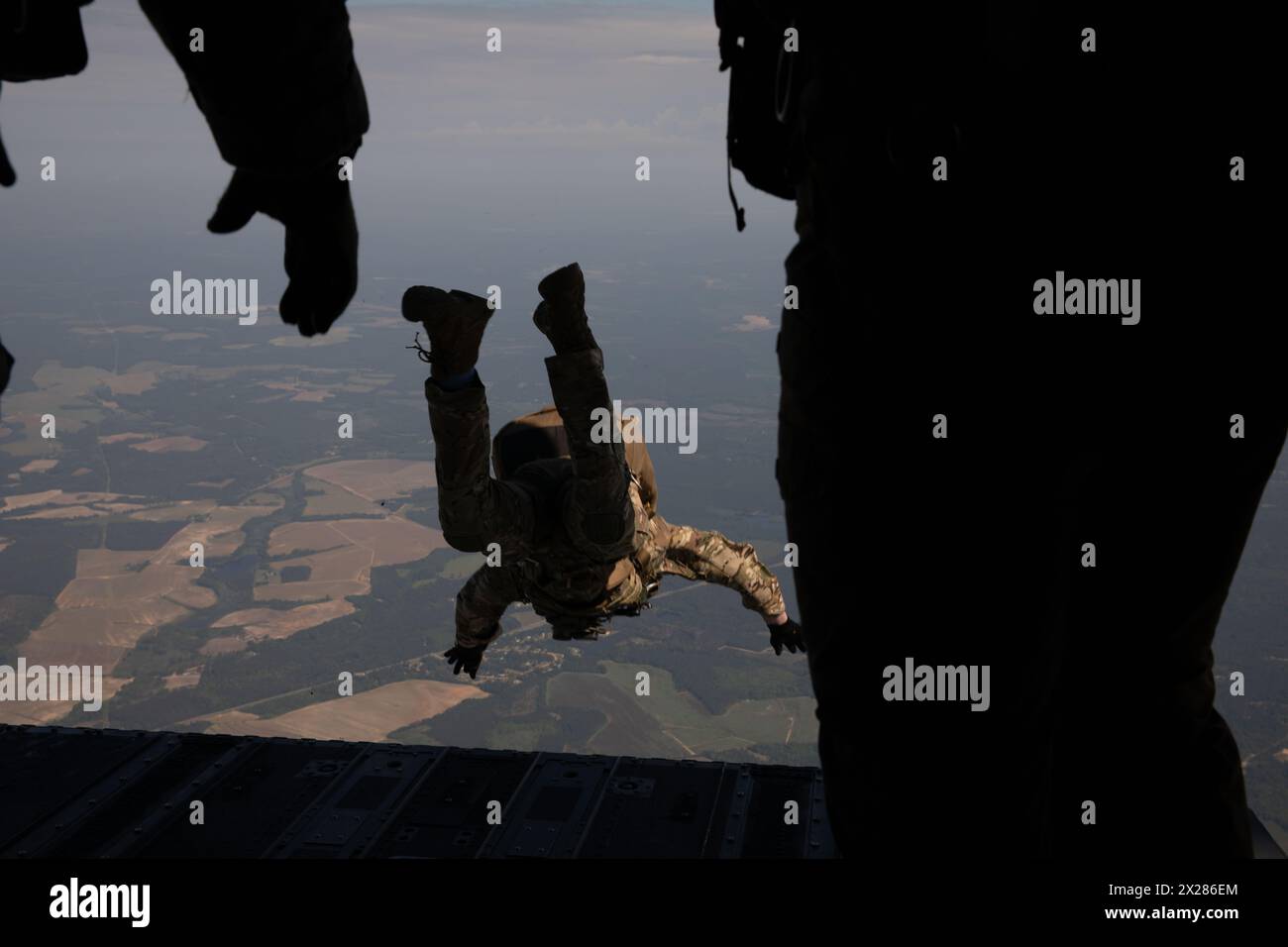 A U.S. Army Soldier conducts a free fall airborne jump out of a CH-47 ...