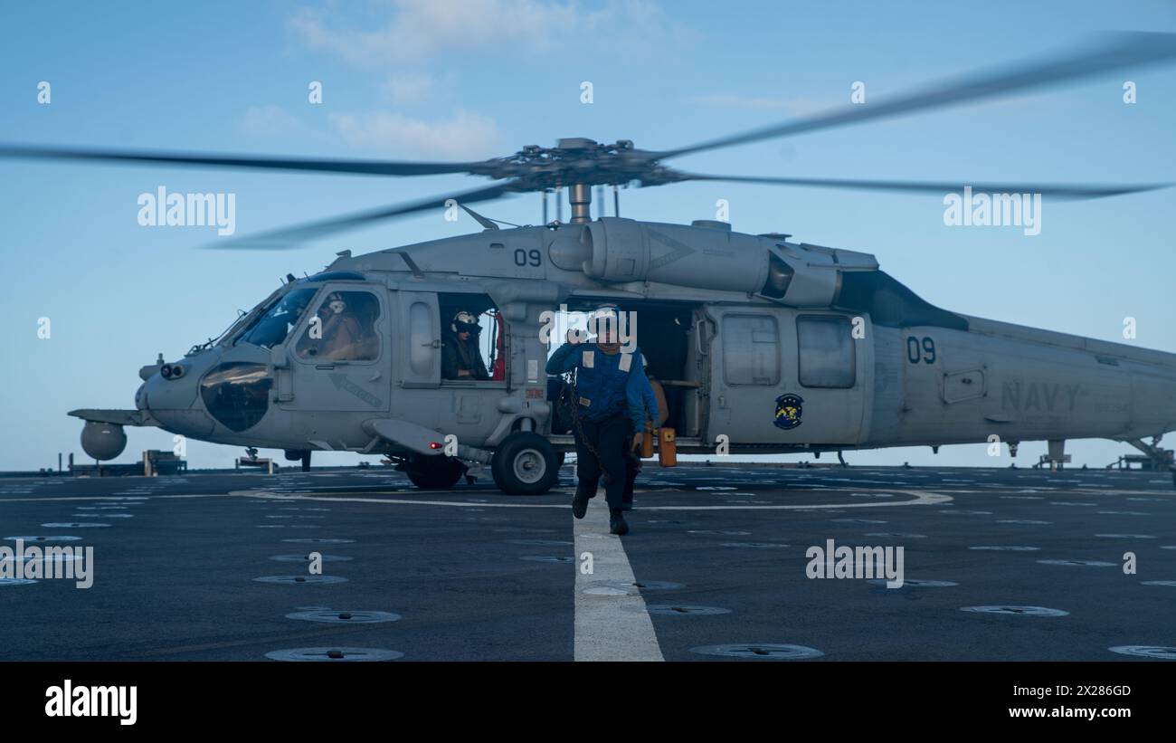 U.S. Sailors assigned to the amphibious dock landing ship USS Harpers ...