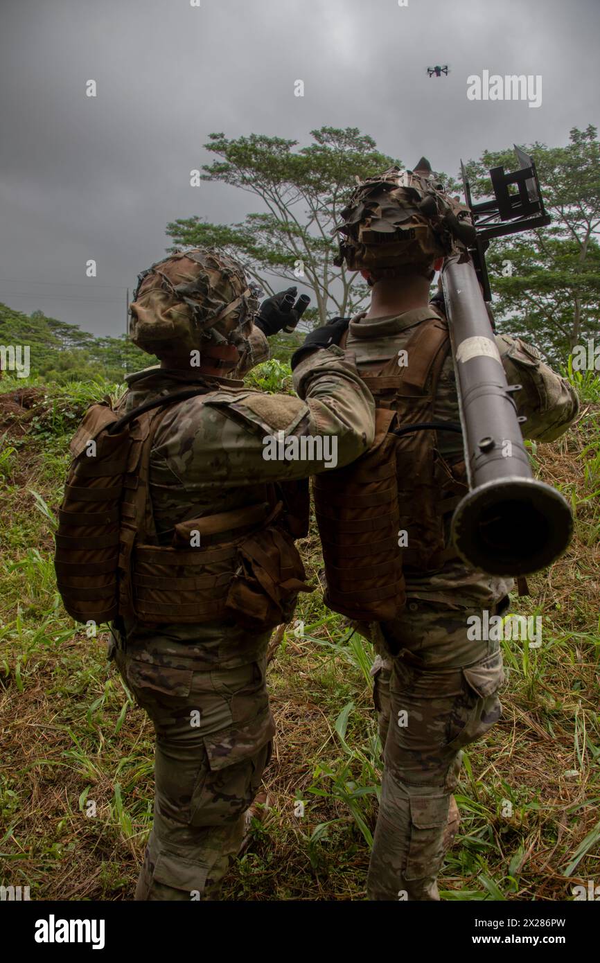 U.S. Army Soldiers from the 25th Infantry Division take aim at an ...