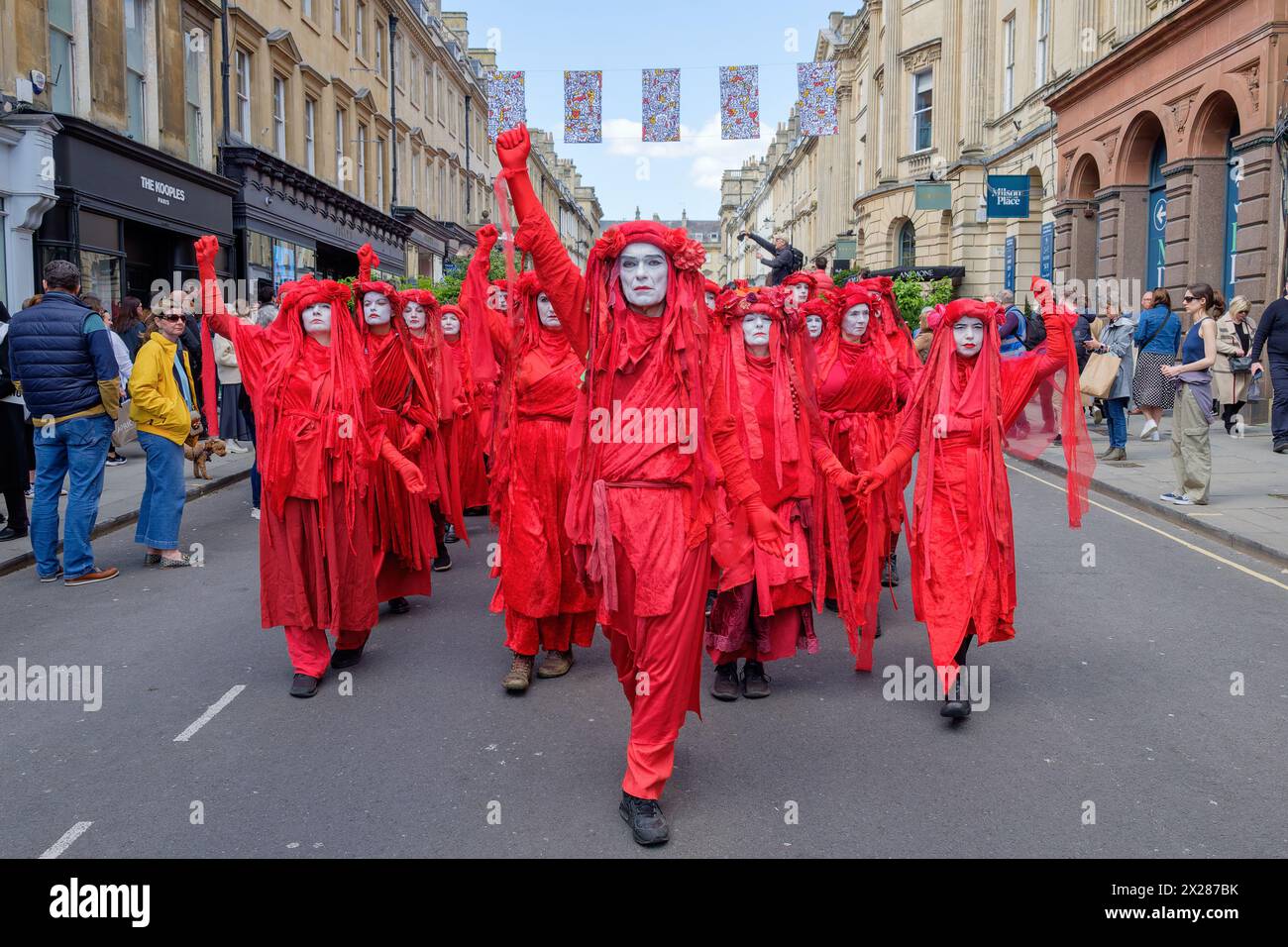Bath, UK. 20th Apr, 2024. Dressed in their distinctive red rebel ...