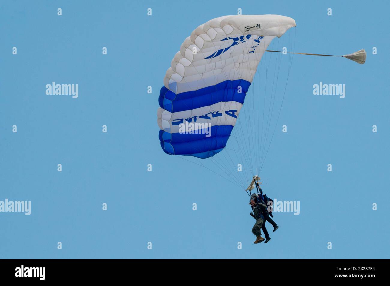 A United States Air Force Academy Wings of Blue member conducts a ...