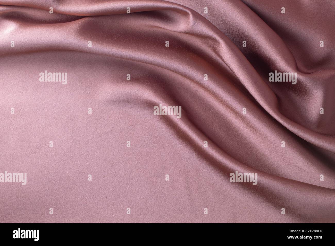 Smooth elegant pink silk or satin luxury cloth texture can use as abstract background. Luxurious ...