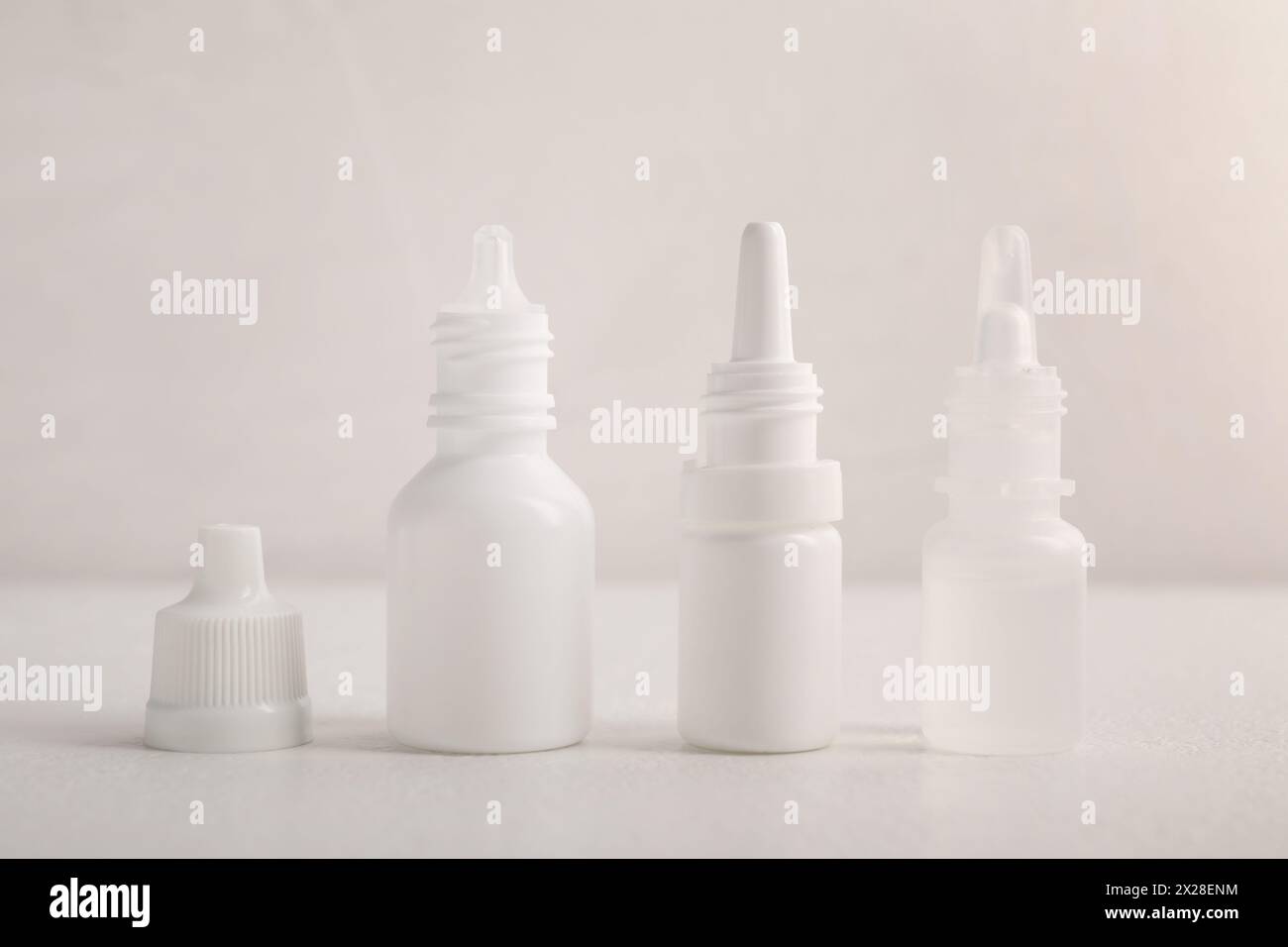 Bottles of medical drops on white background Stock Photo - Alamy