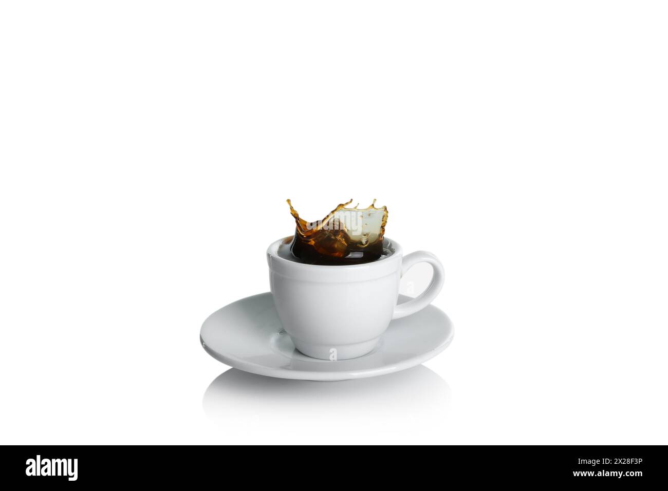 Coffee splashing in cup on white background Stock Photo - Alamy