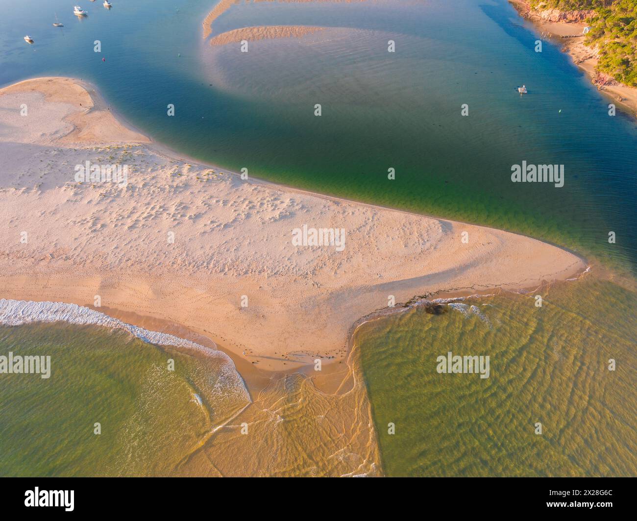 Aerial view of white sand bar at the mouth of an estuary at Merimbula ...