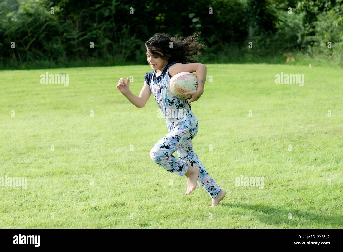 Child and playing rugby hi-res stock photography and images - Alamy