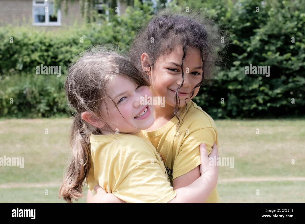 Two girls hugging hi-res stock photography and images - Alamy