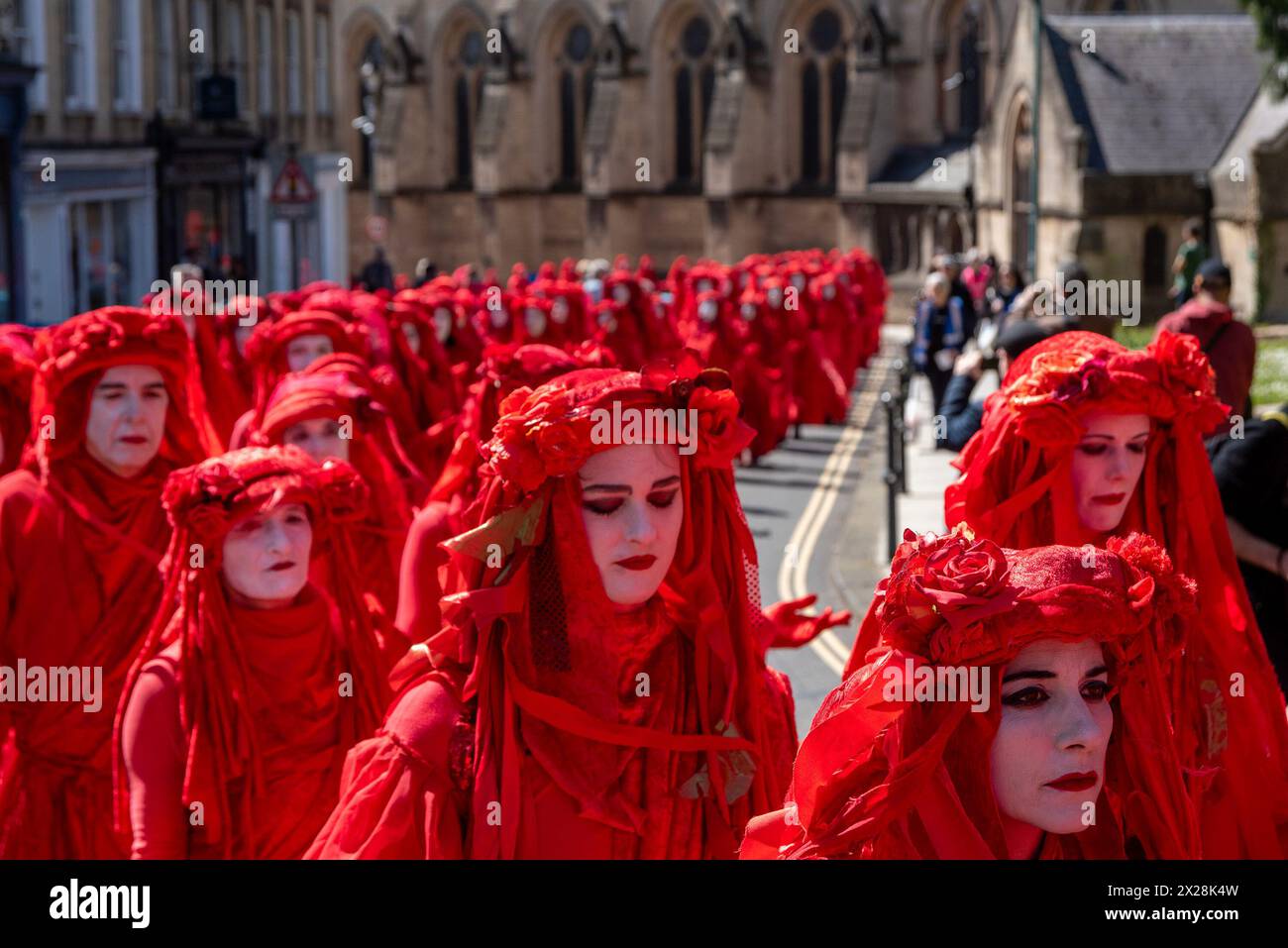 Bath, UK. 20th Apr, 2024. Red Rebels march on the street of Bath during ...