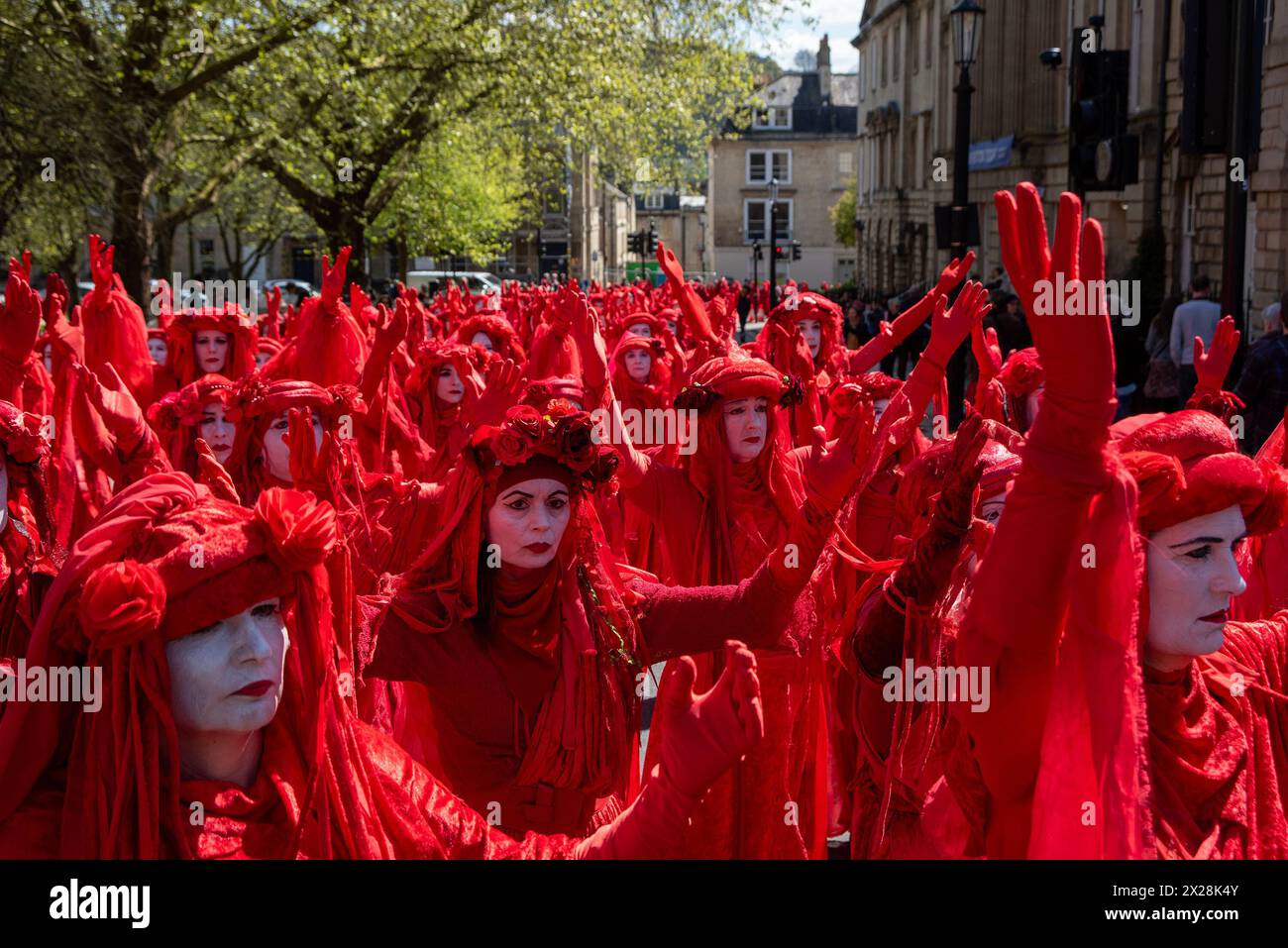 Bath, UK. 20th Apr, 2024. Red Rebels march on the street of Bath during ...