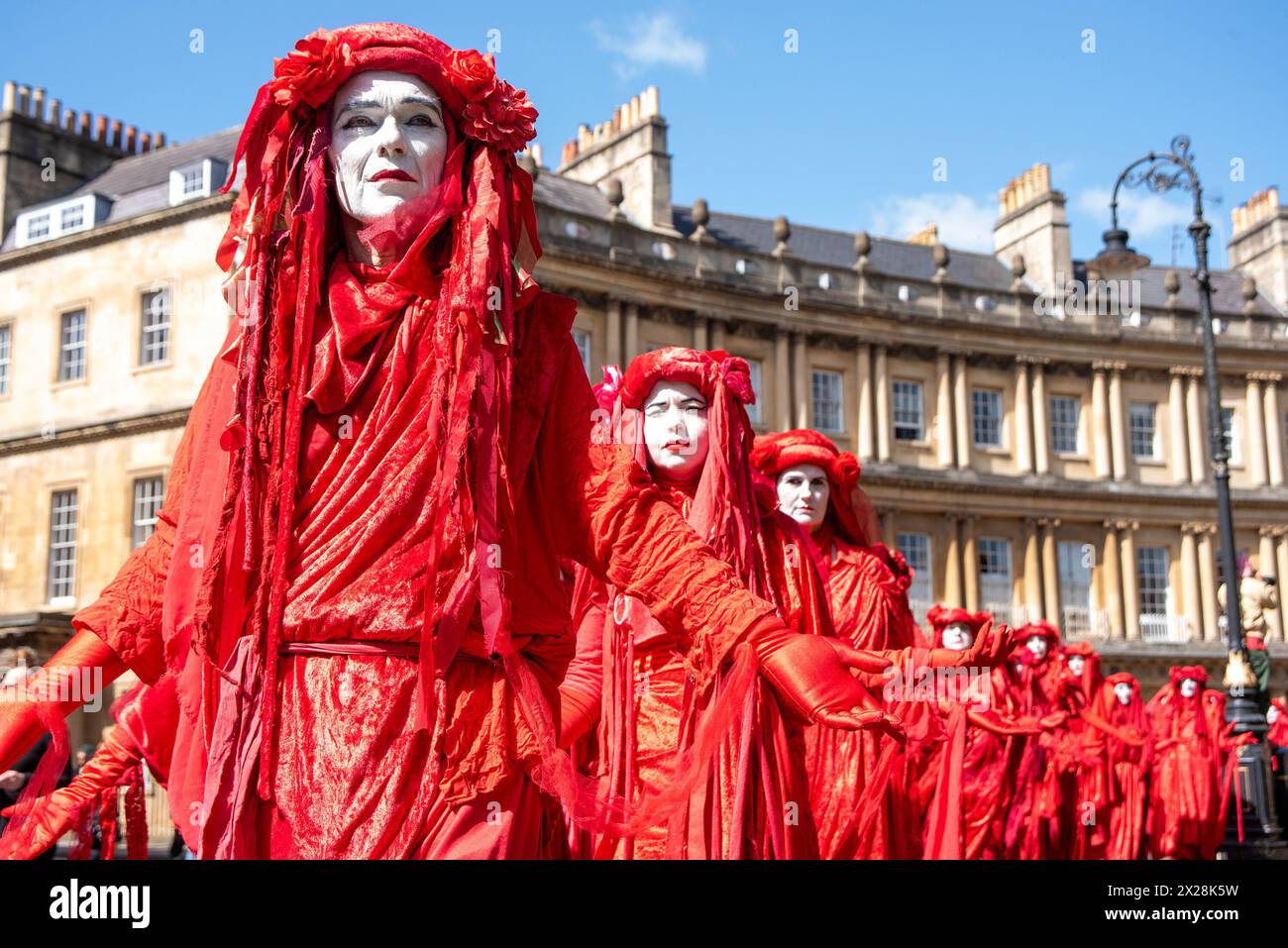 Bath, UK. 20th Apr, 2024. Red Rebels march on the street of Bath during ...