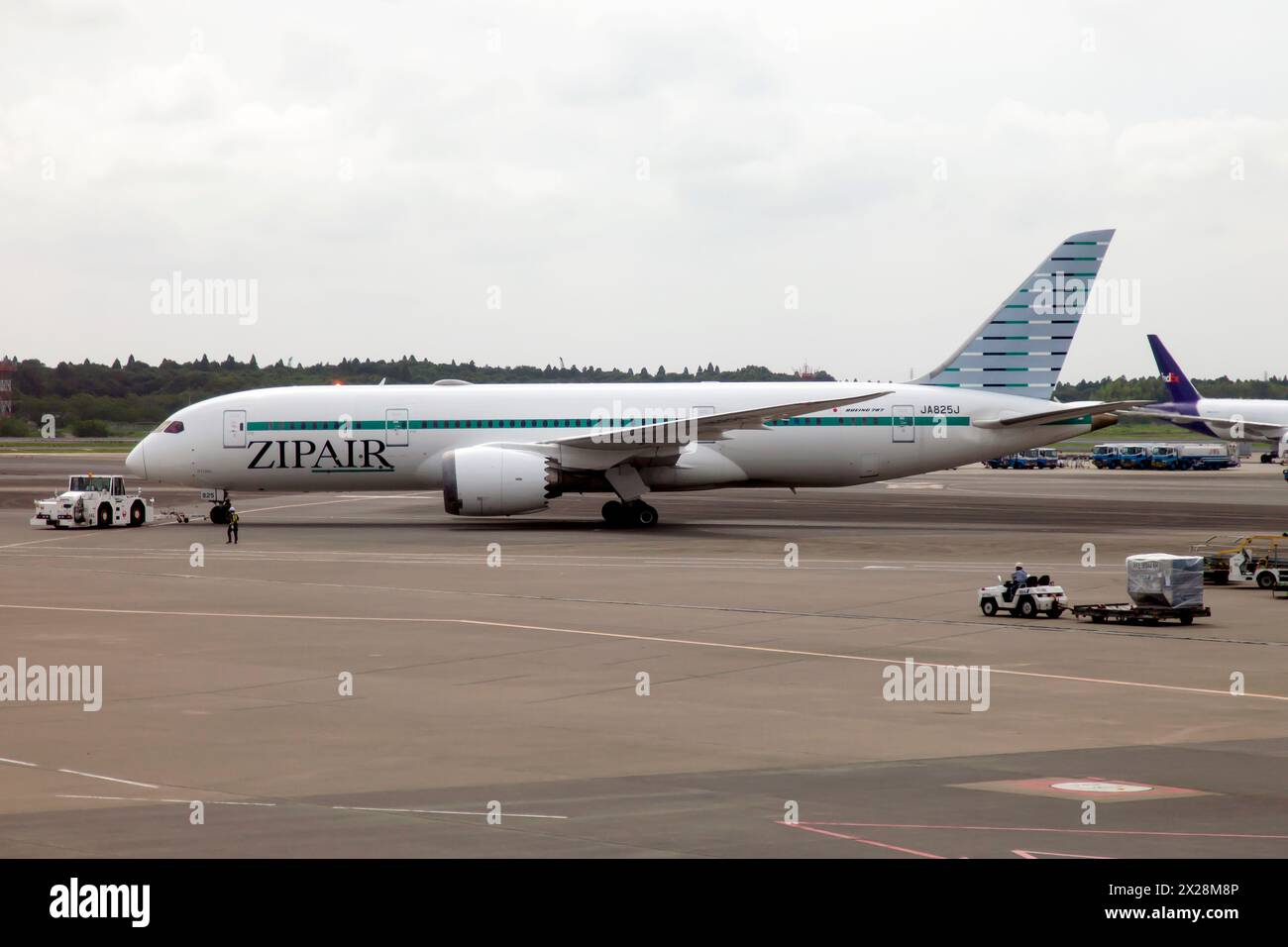 A Zipair Boeing 787-8 Dreamliner being pushed at Tokyo Narita airport ...
