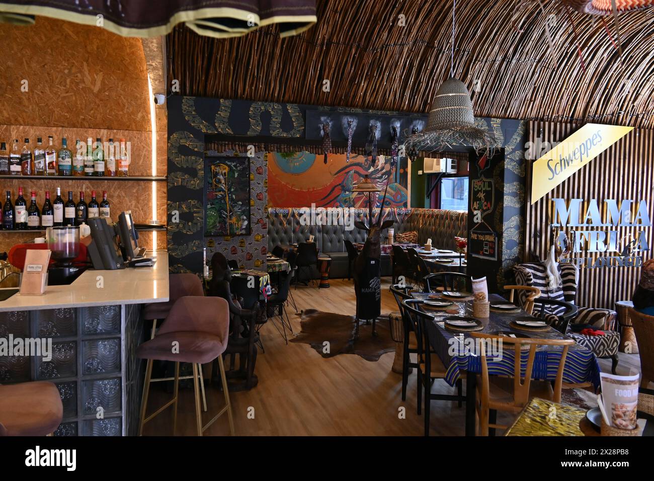 View of the interior of Mama Africa, a tyipical african restaurant in Cape Town, South Africa ...