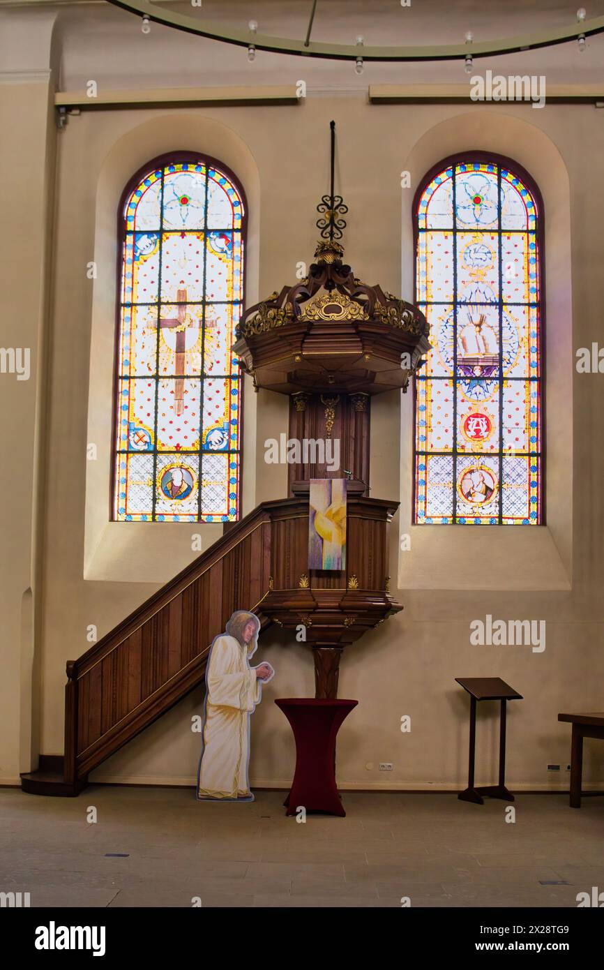 Weinheim, Germany - May 19, 2021: Stained glass windows on a wall in a ...