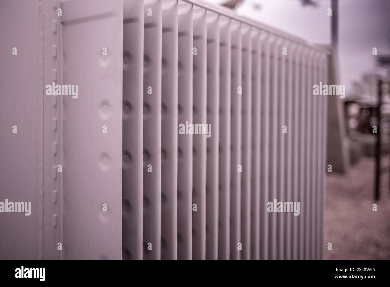 Selective focus on an electric transformer outside a commercial ...