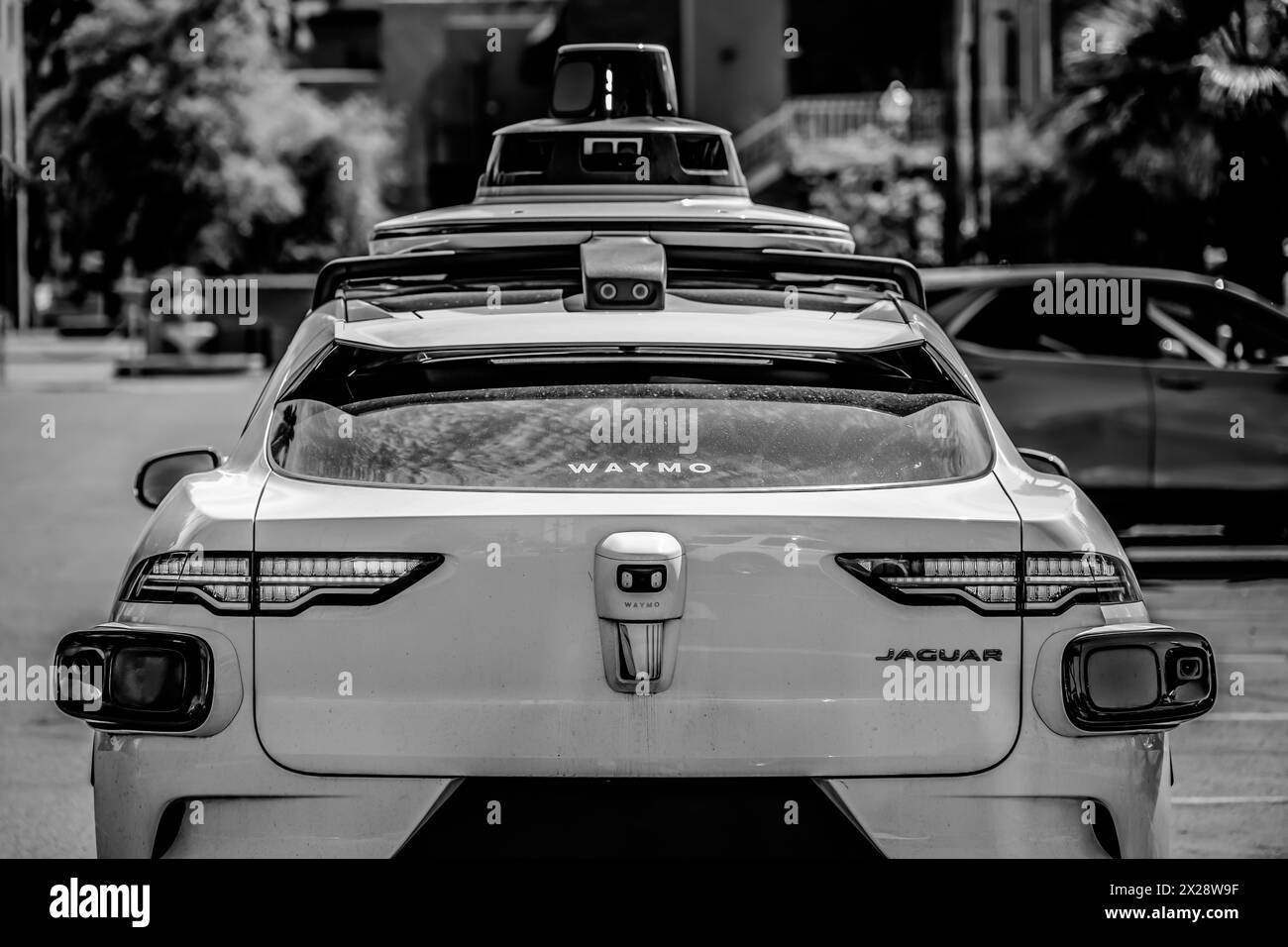 Phoenix, Arizona, USA - 3.23.2024: Behind a Waymo self-driving car ...
