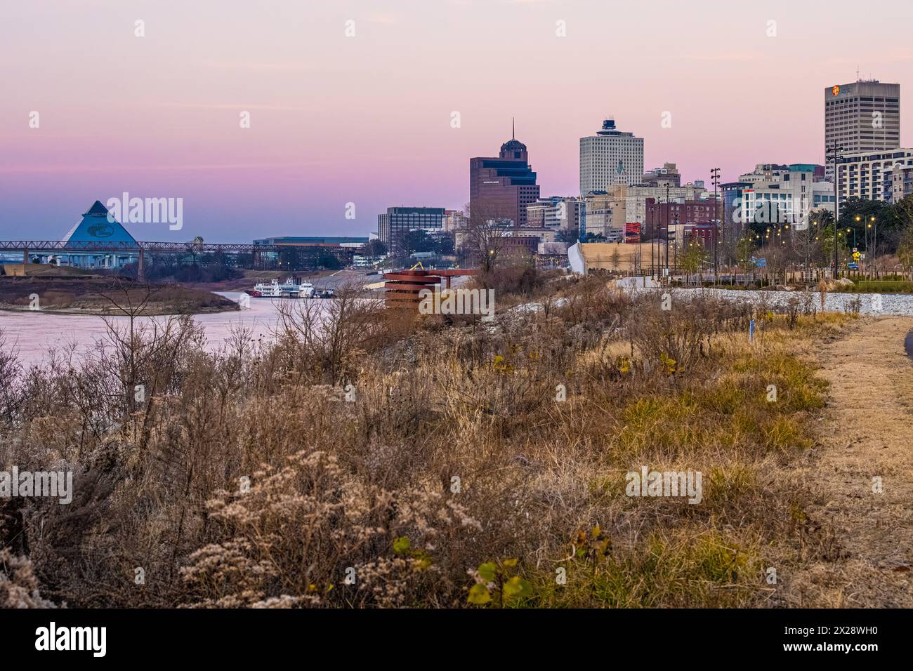 Memphis, Tennessee, riverfront and downtown buildings at dusk along the ...