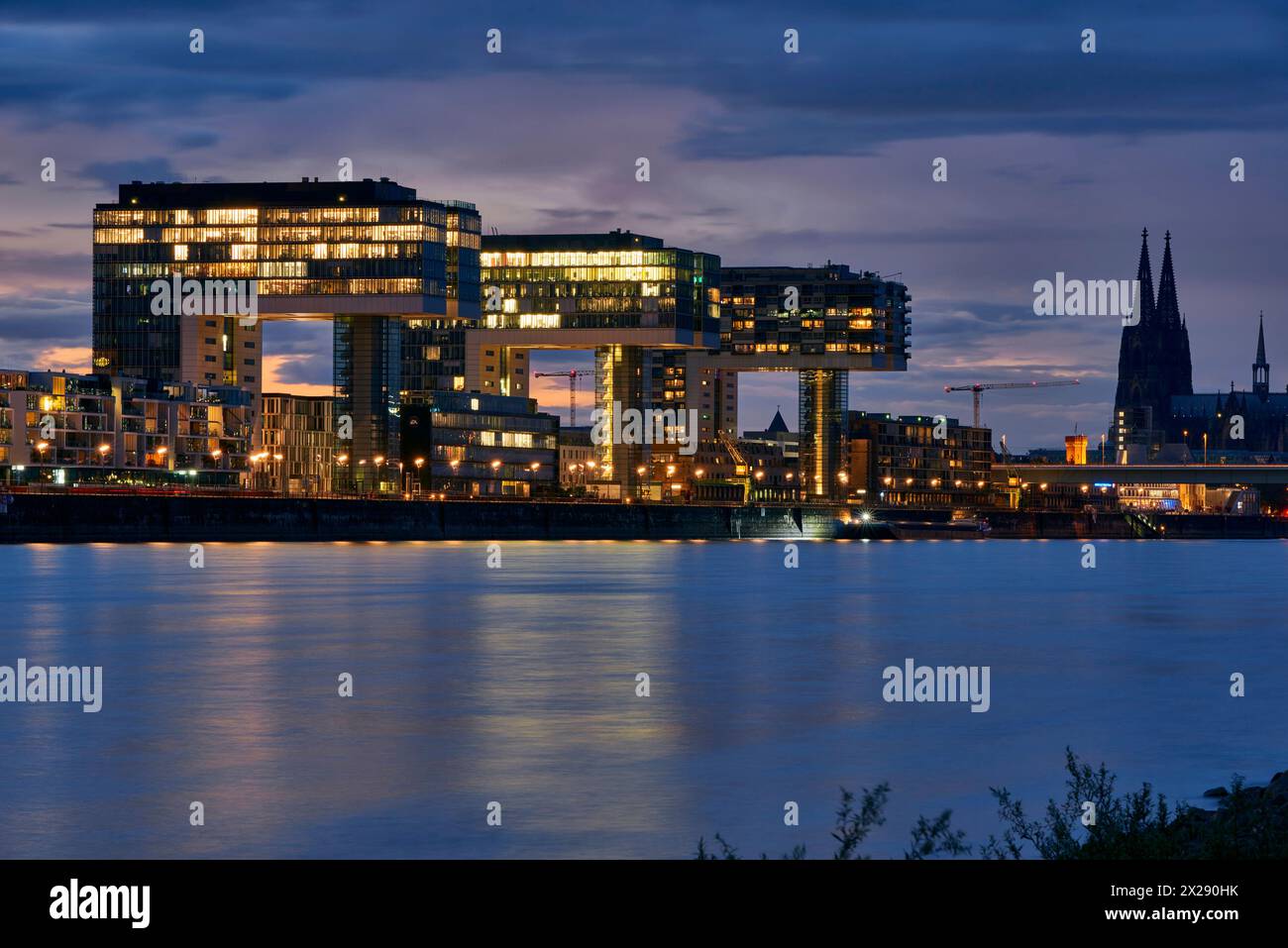 Night view on the Crane Houses on the banks of the Rhine river. Cologne ...