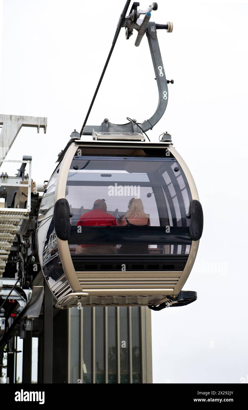 A middle-aged couple inside a gondola of the Vilanova de Gaia cable car ...