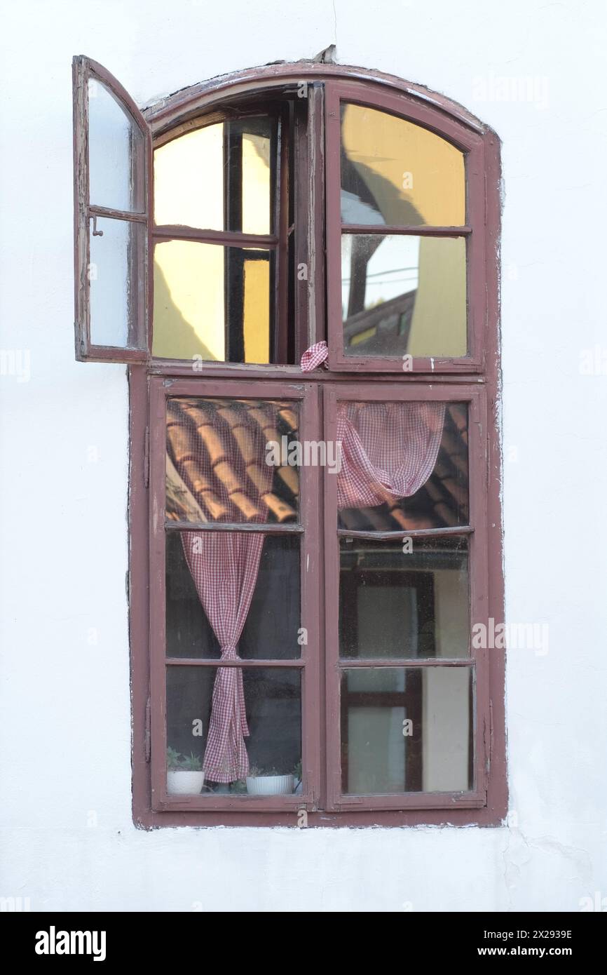 reflection on old wooden window in Tesnjar Bazaar of Valjevo city ...