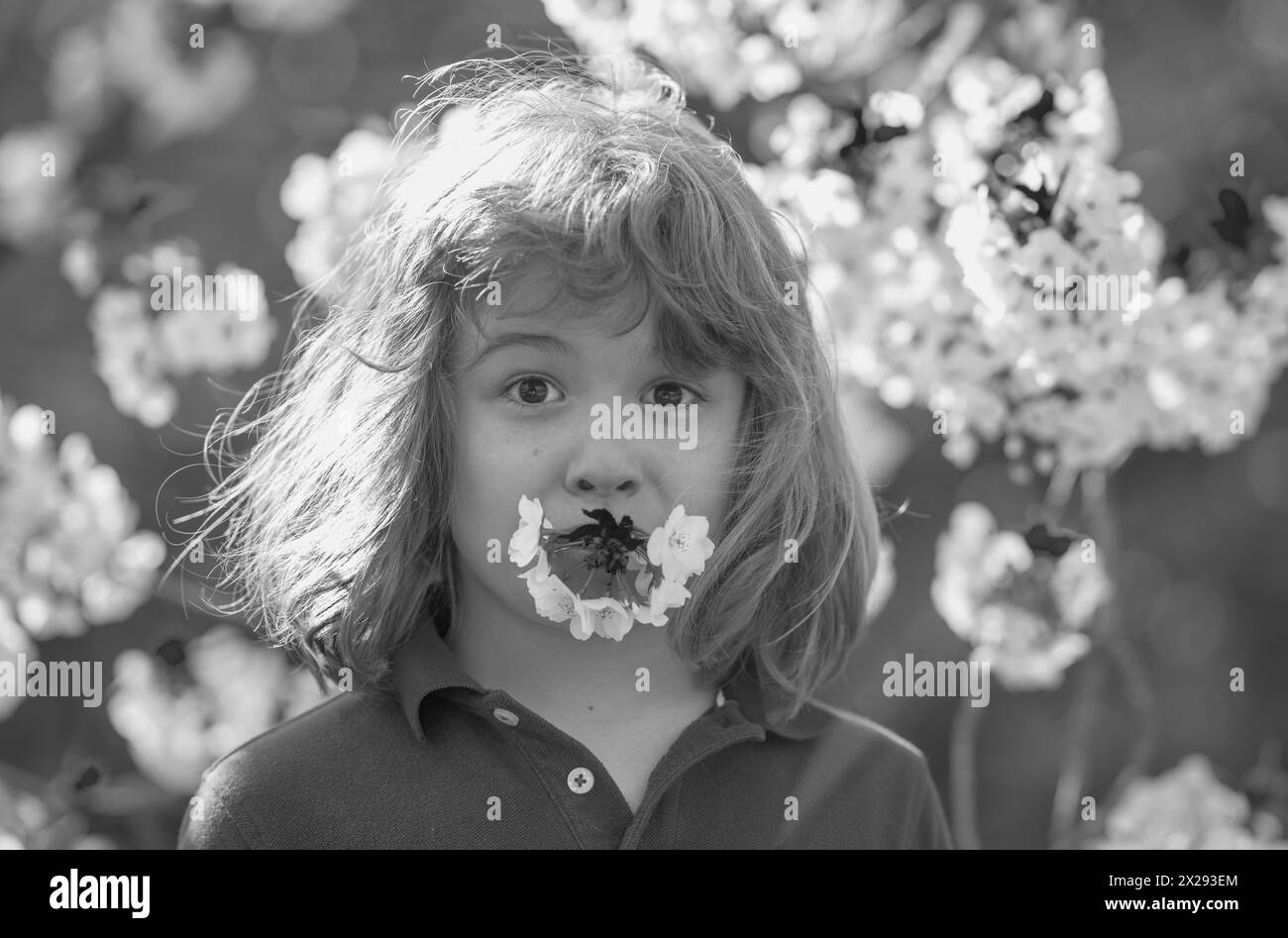 Kid in spring cherry blossom park. Happy childhood. Spring holidays ...