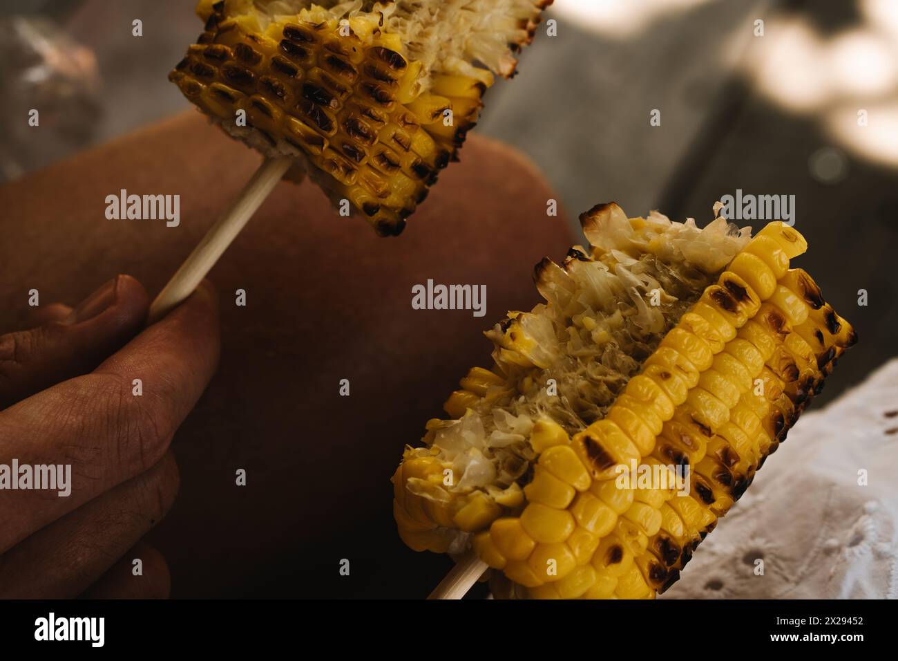 juicy summer corn and two people Stock Photo - Alamy