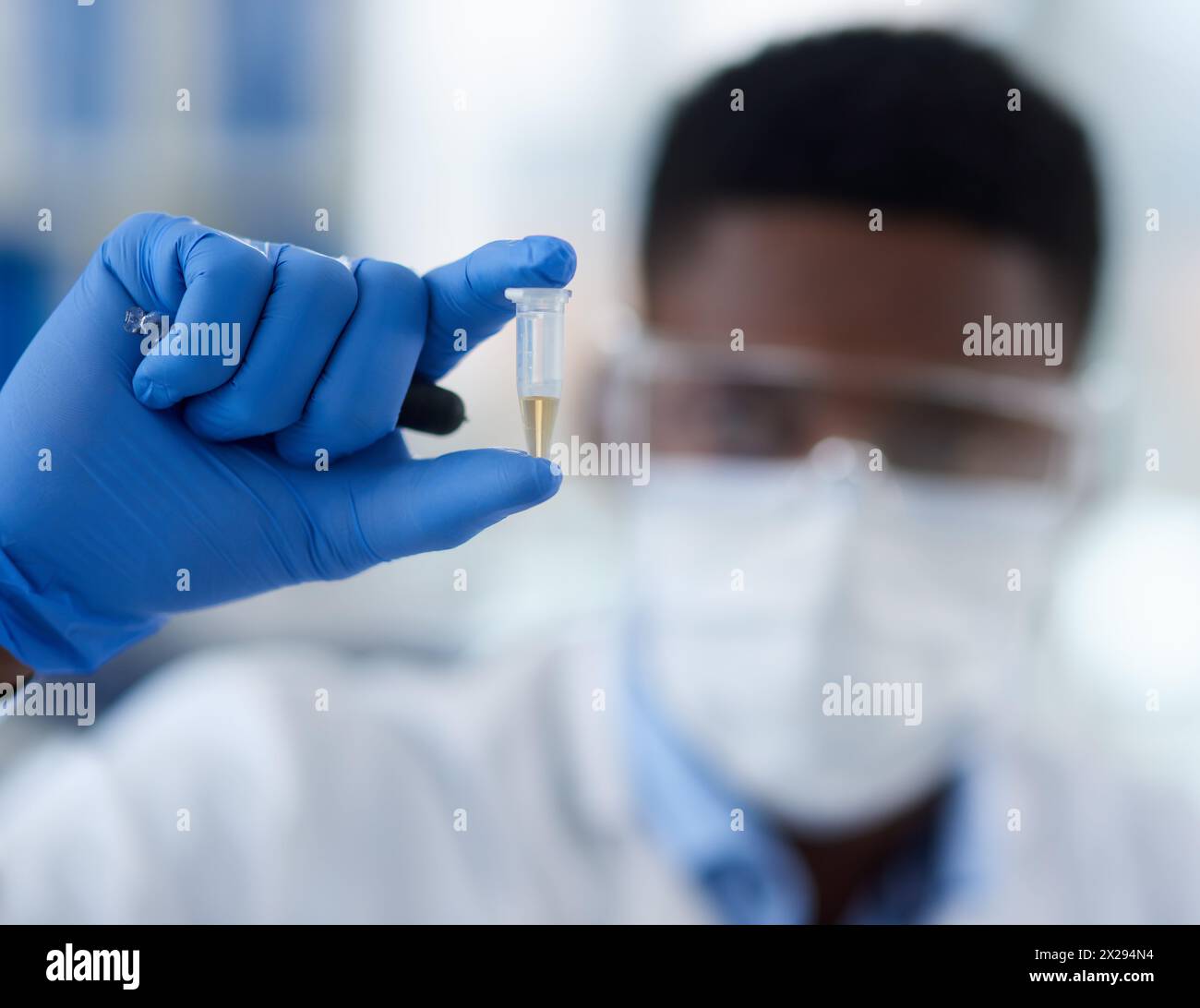 Hands, scientist and vial of fluid for research, chemical liquid and ...