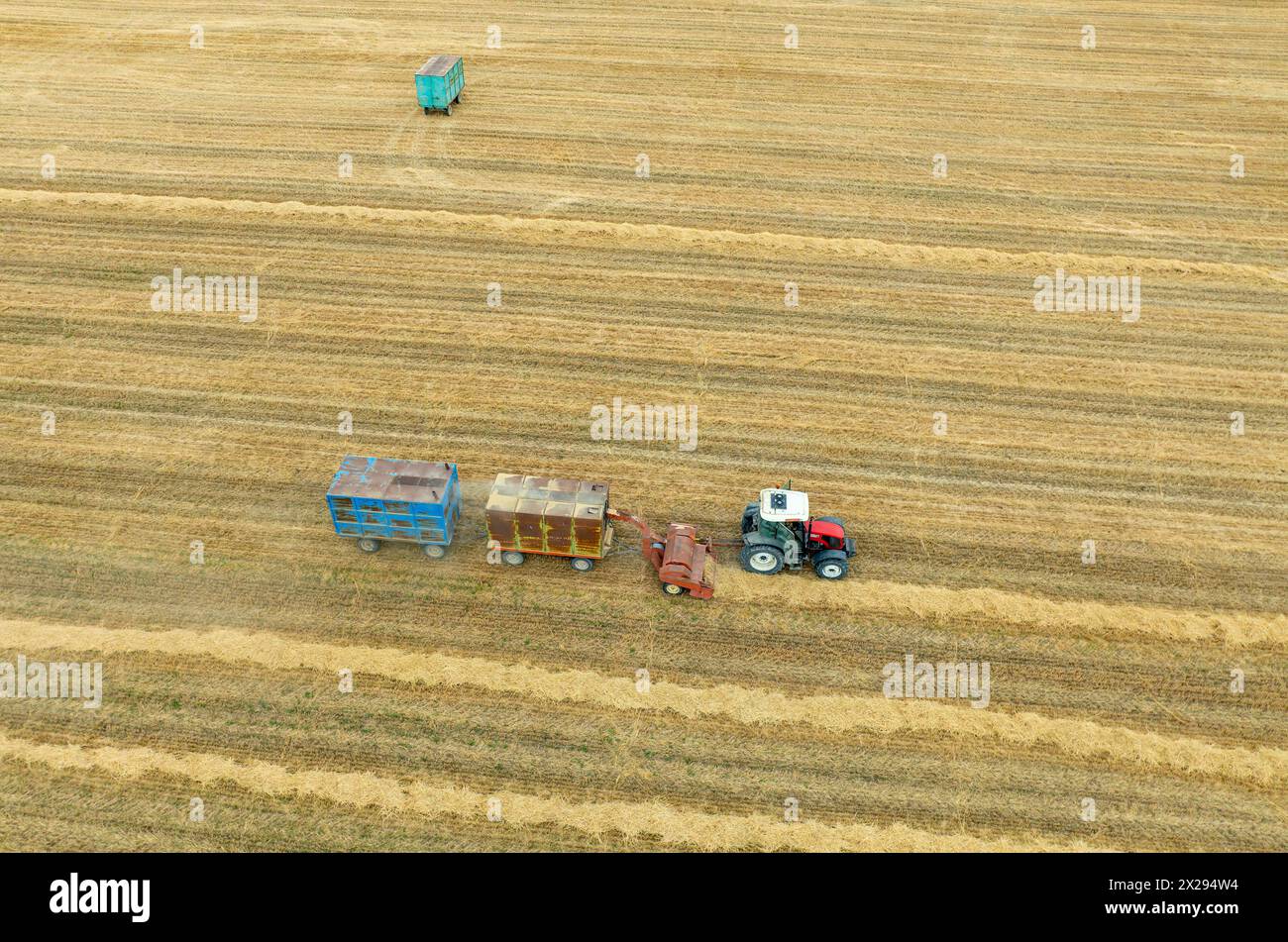 Farm field, farmers work with tractor on farmland Stock Photo - Alamy