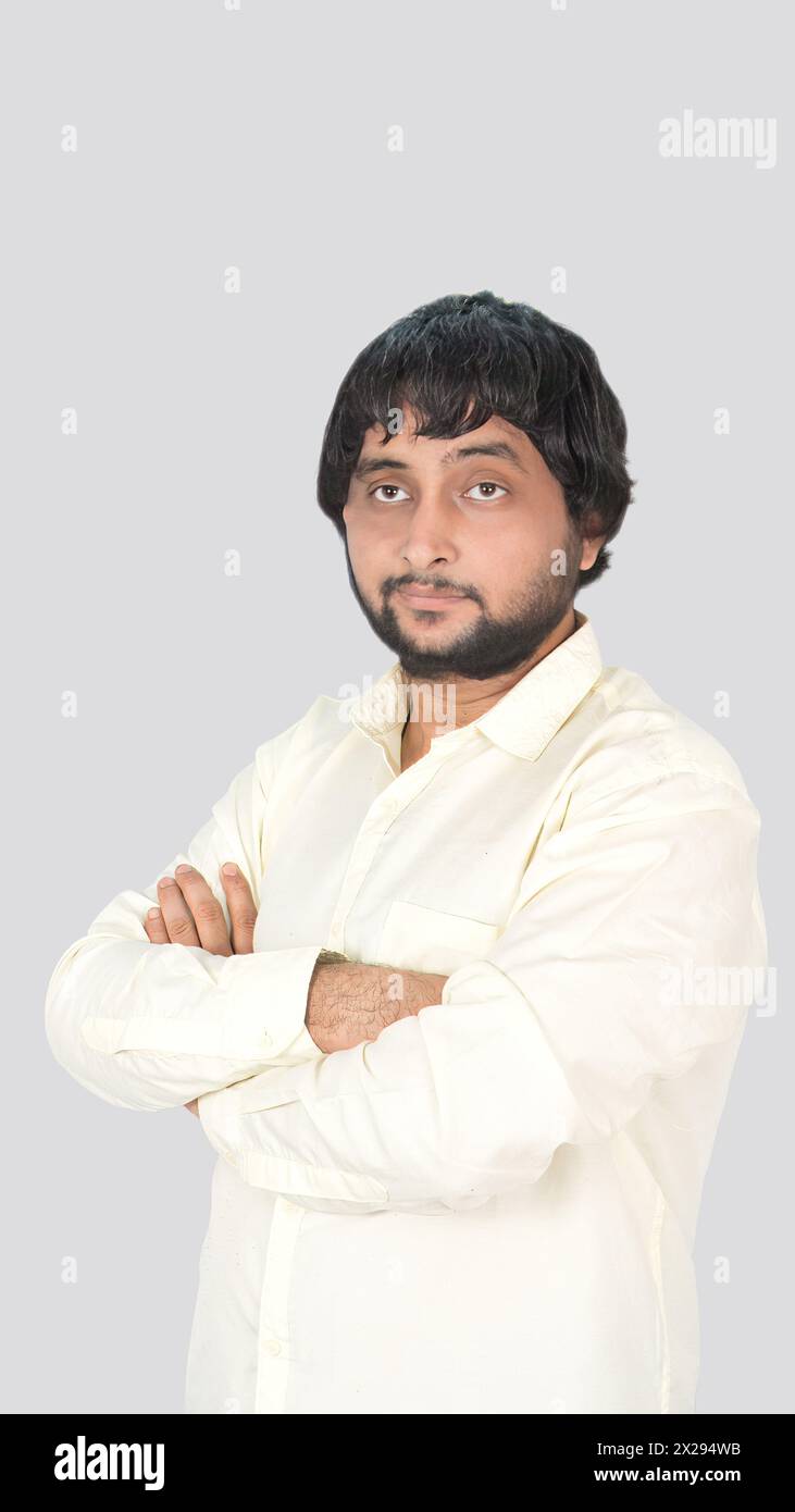 Confident Indian man standing in style with crossed arms Stock Photo ...