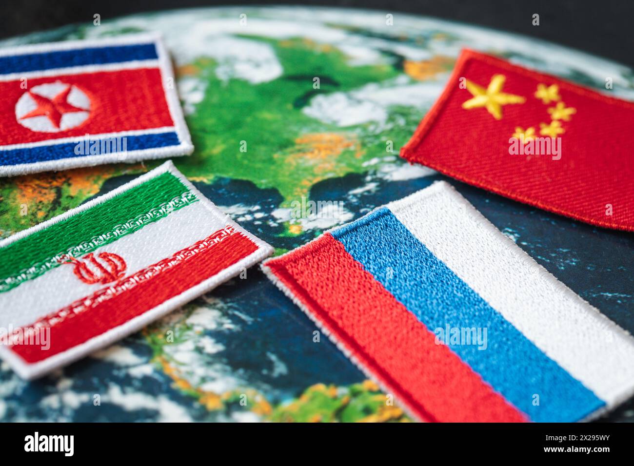 Symbols of Russia, China, North Korea and Iran against the background ...
