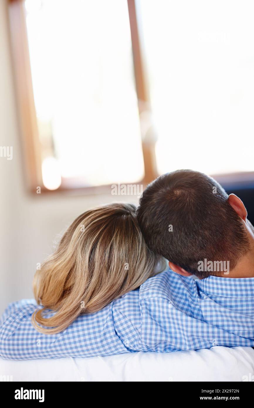 Couple, hugging and love in house with couch for romance, sitting ...