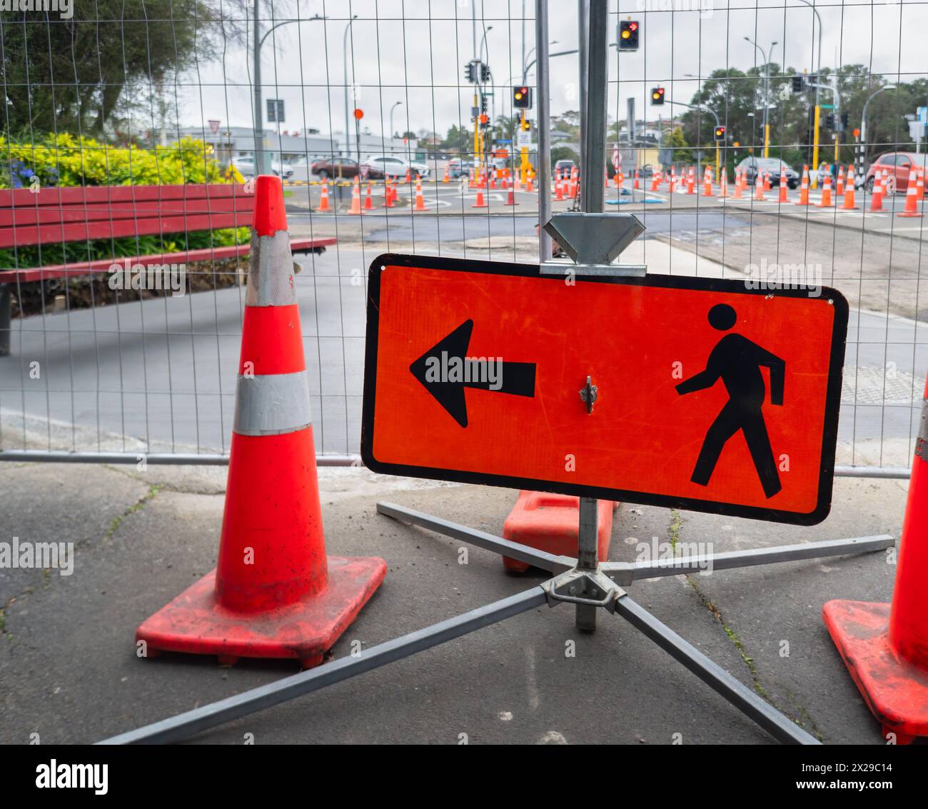 Man Walking Road sign in front of a closed footpath. Traffic cones and ...