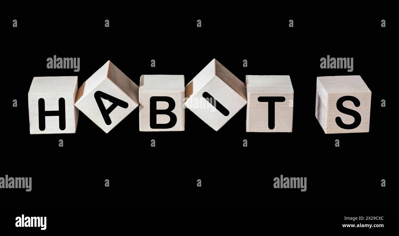 The word Habits written on wooden cubes and black background Stock ...