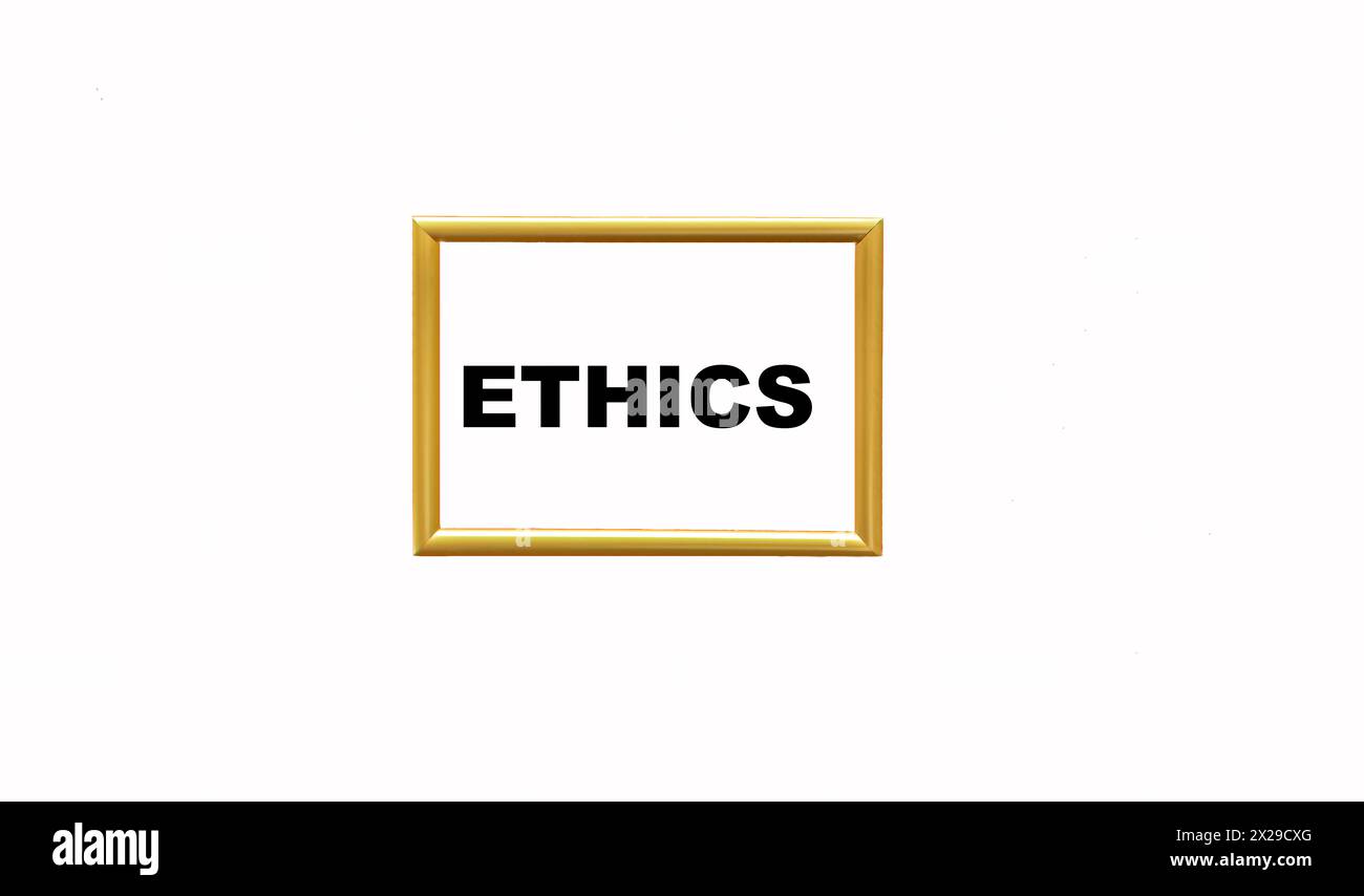 The word ETHICS is written on a golden beautiful frame and on a white ...