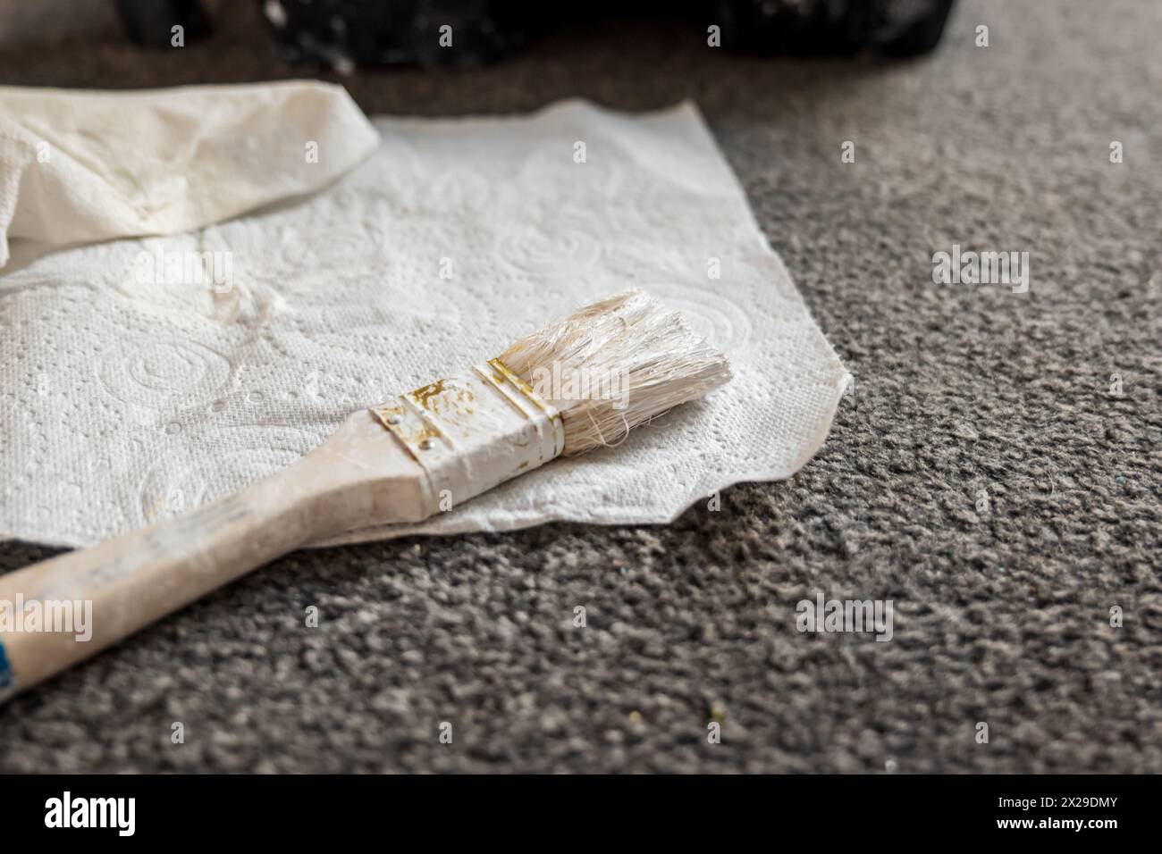 Paint brush on paper tissue during home renovation Stock Photo - Alamy