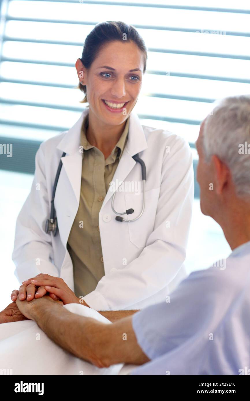 doctor attending to patient in hospital room, Onkologikoa Hospital ...
