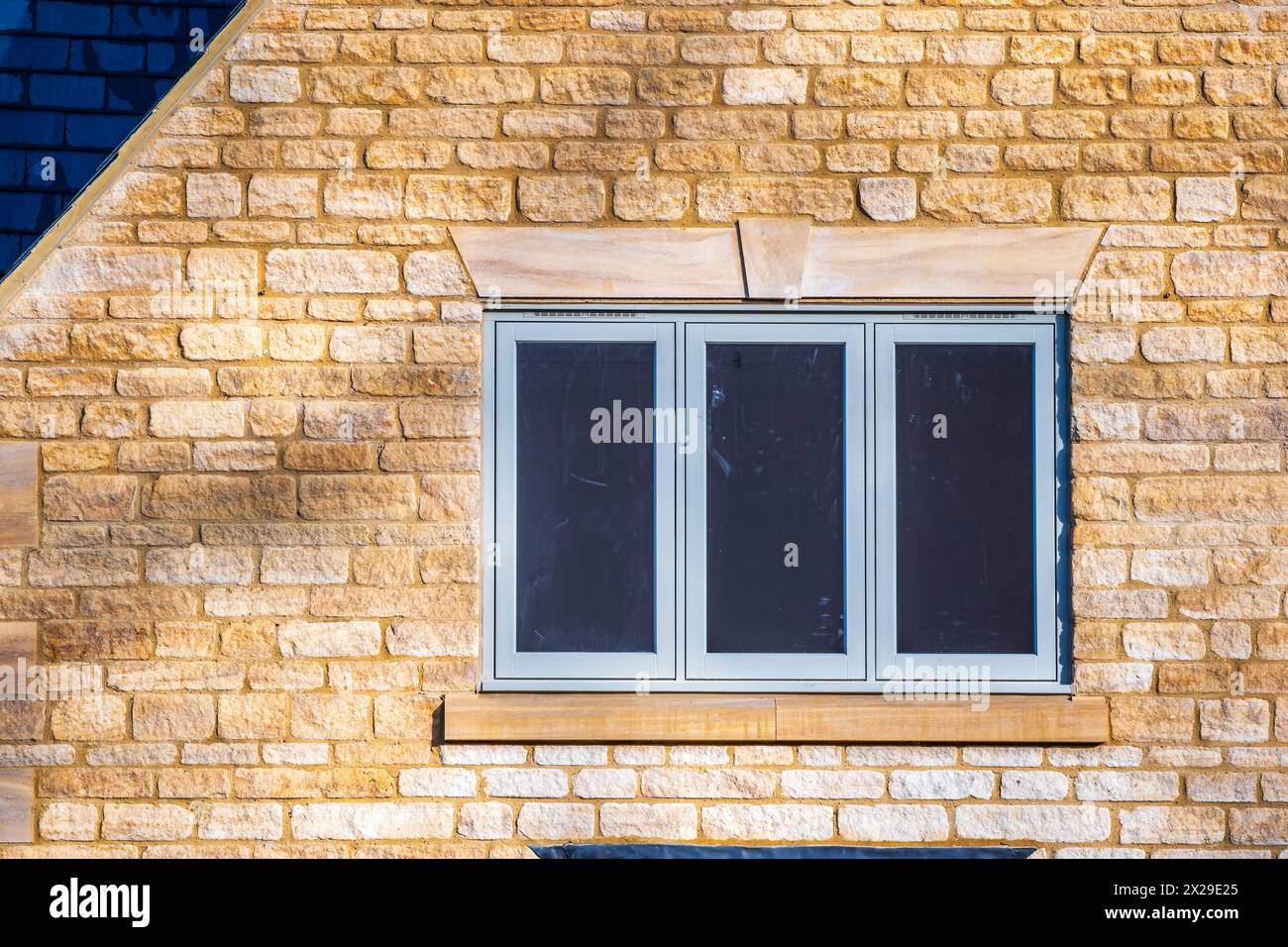 New build cotswold stone brick house in england uk Stock Photo - Alamy