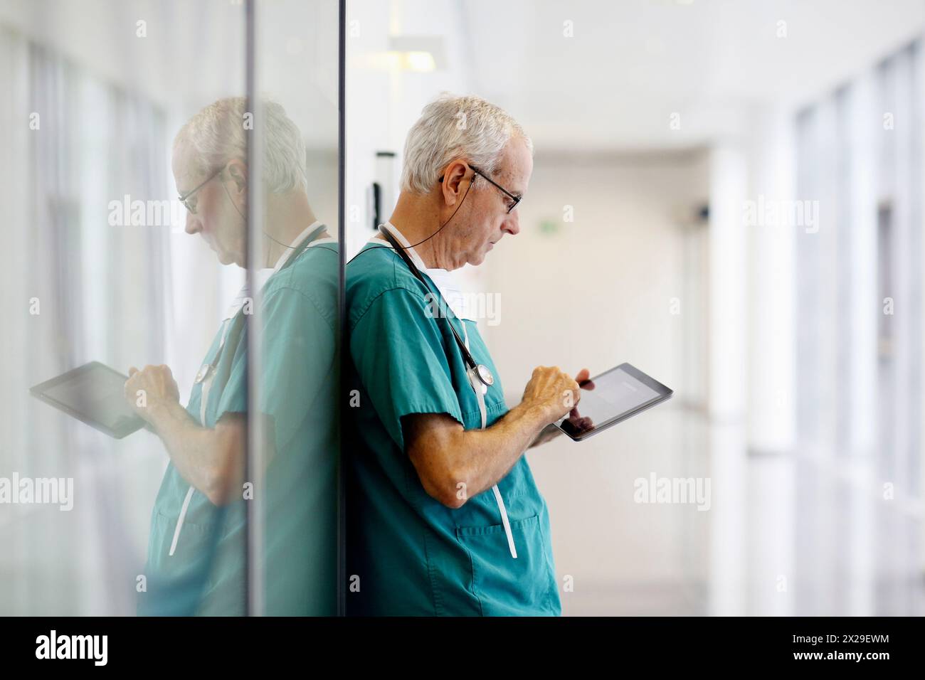 surgeon with tablet in the operating room hallway, Onkologikoa Hospital ...