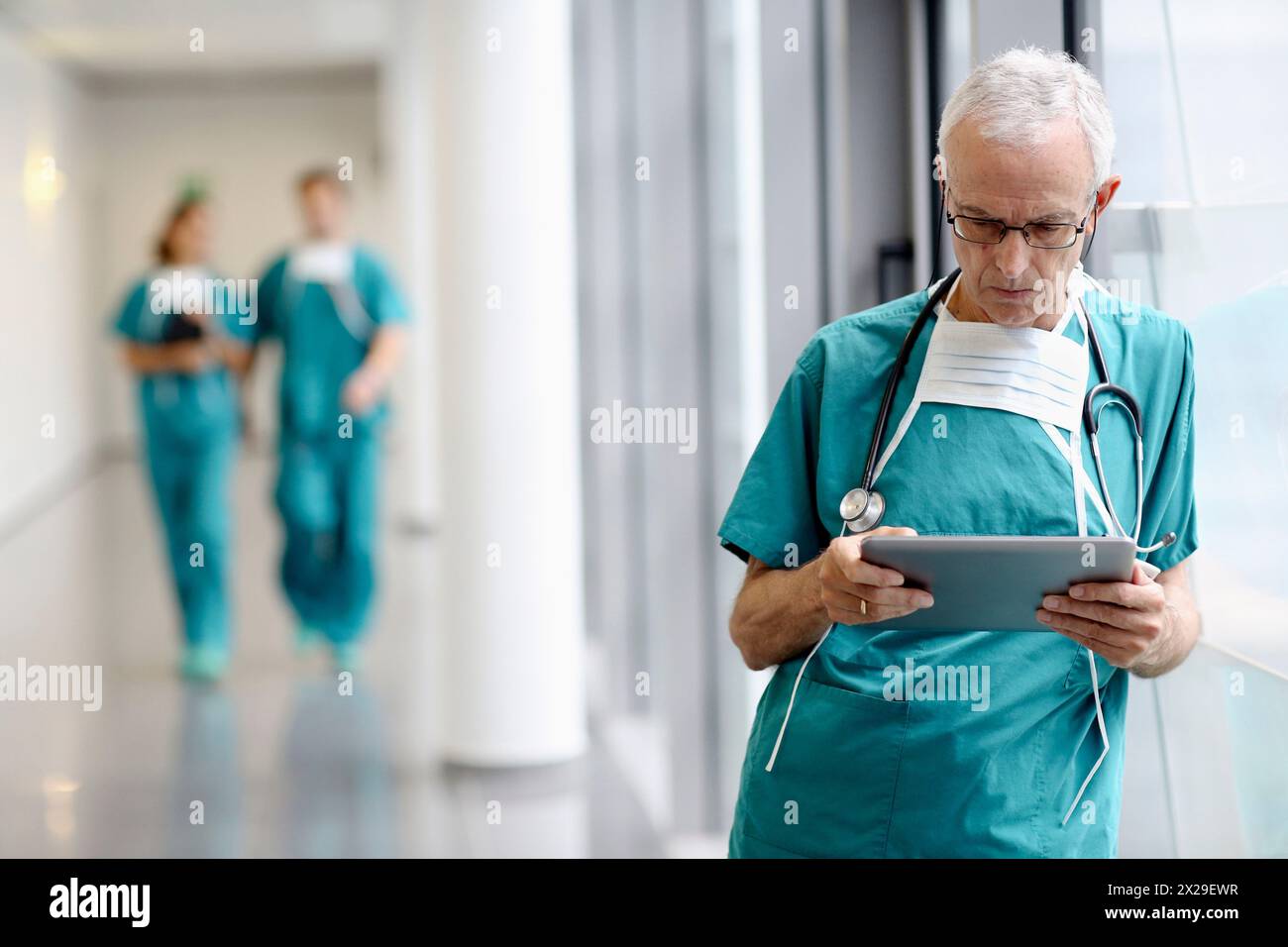 surgeon with tablet in the operating room hallway, Onkologikoa Hospital ...