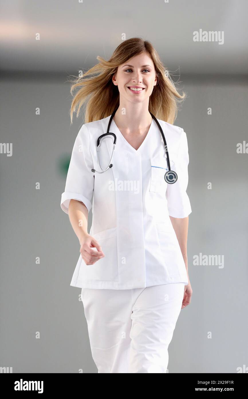 Nurse walking hall hi-res stock photography and images - Alamy