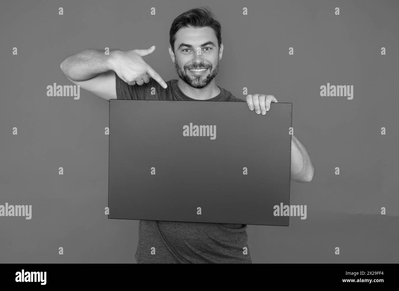 Man Holds Sign With Copy Space Placard Ready For Copy Space Product